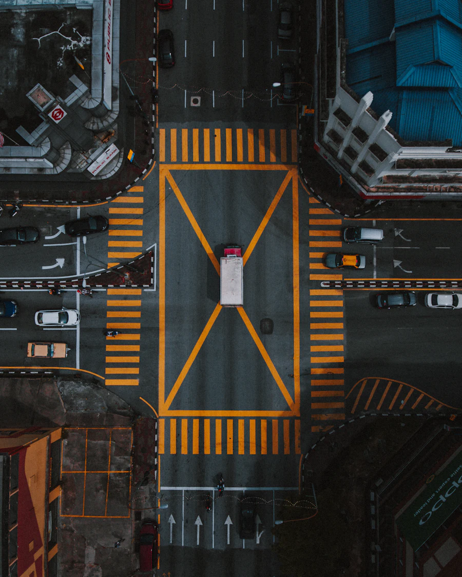 First time visiting  Ipoh, Malaysia. I was waiting for this moment cause so many cars was passing by it hard to get only one vehicle in the middle of the X.  I took so many shots it was scary to stand side of the road but its worth it. Additional   If you a food lover you should go to this city.  :) | aerial photography of intersection