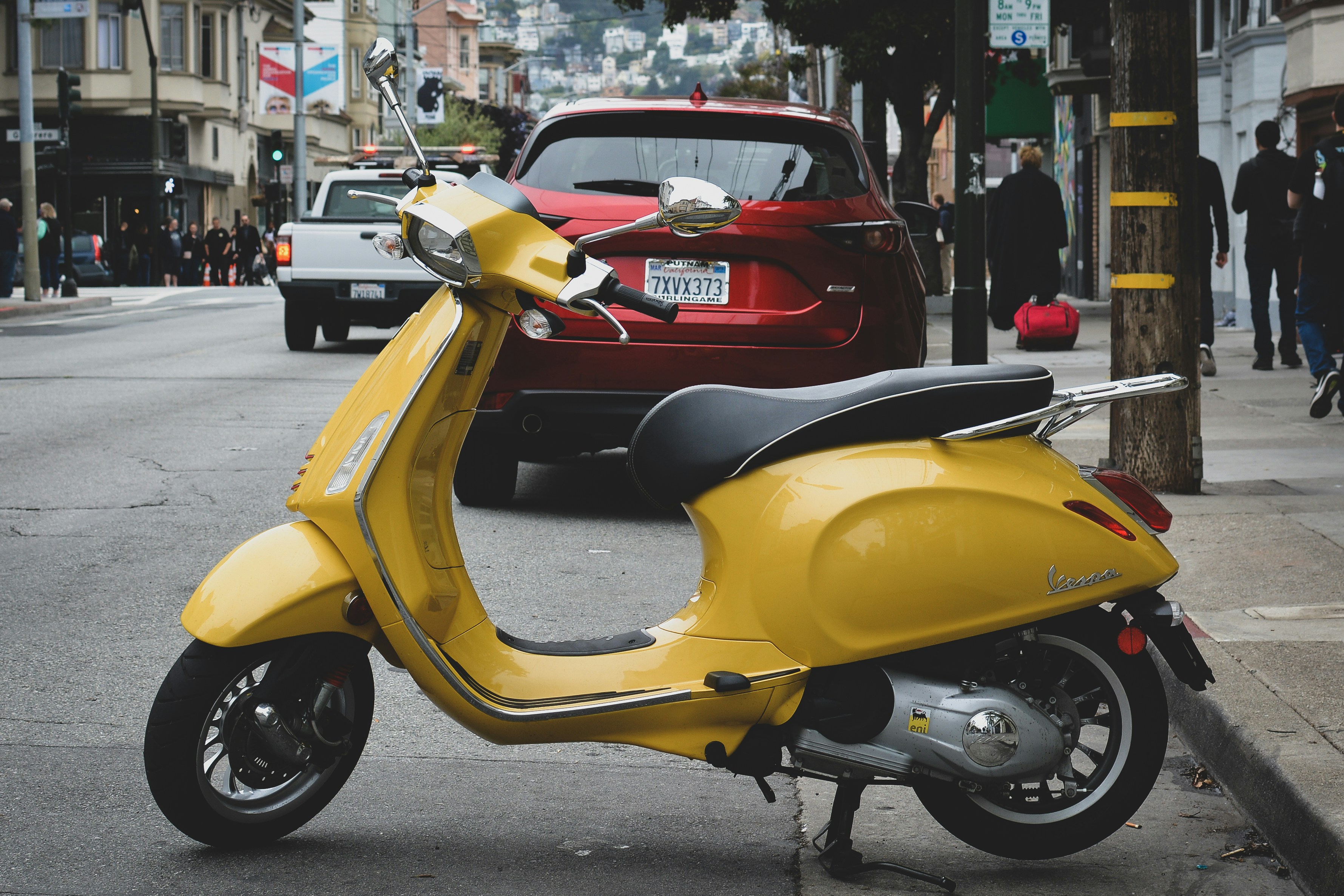 Urban Vibes: The Yellow Vespa in MotionKoushik Chowdavarapu