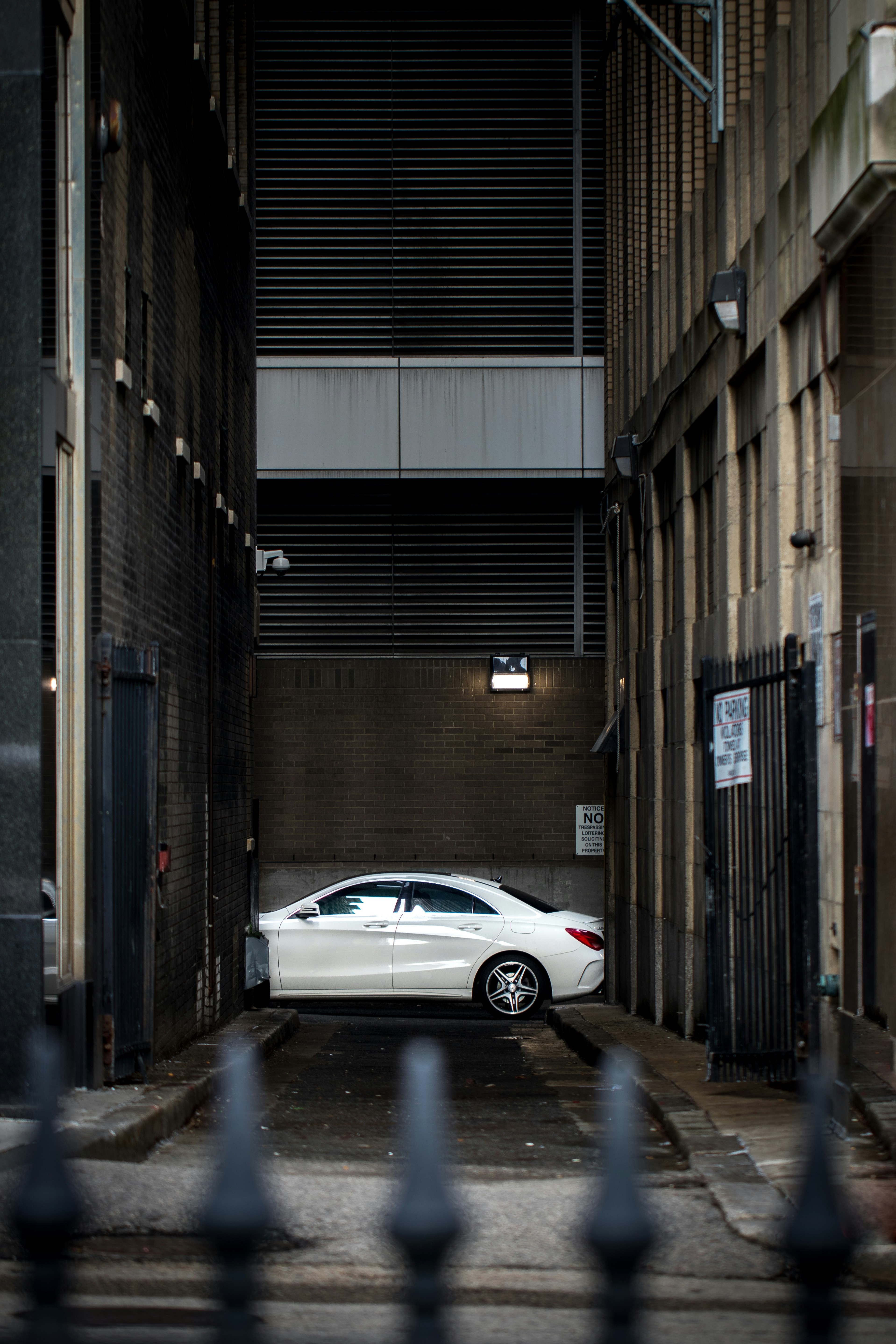 in distant white sedan