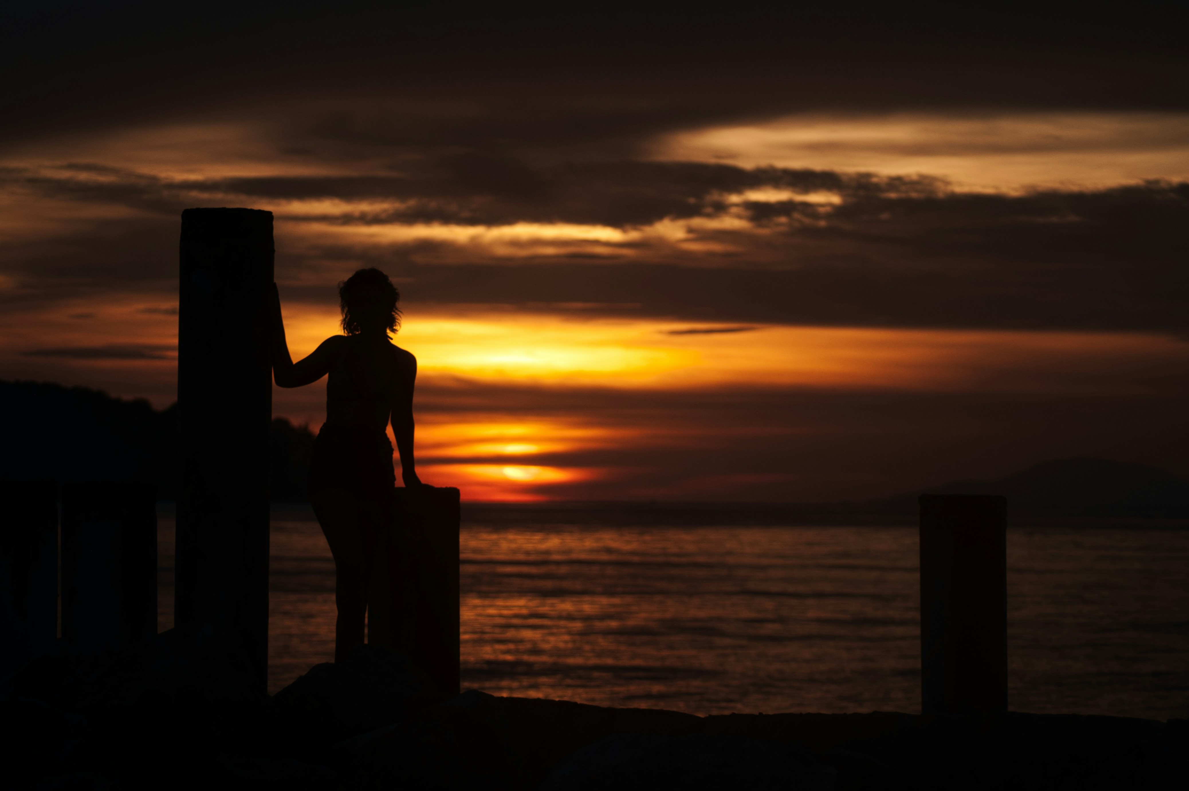Silhouette of woman on dock during orange sunset photo – Free Sea Image ...