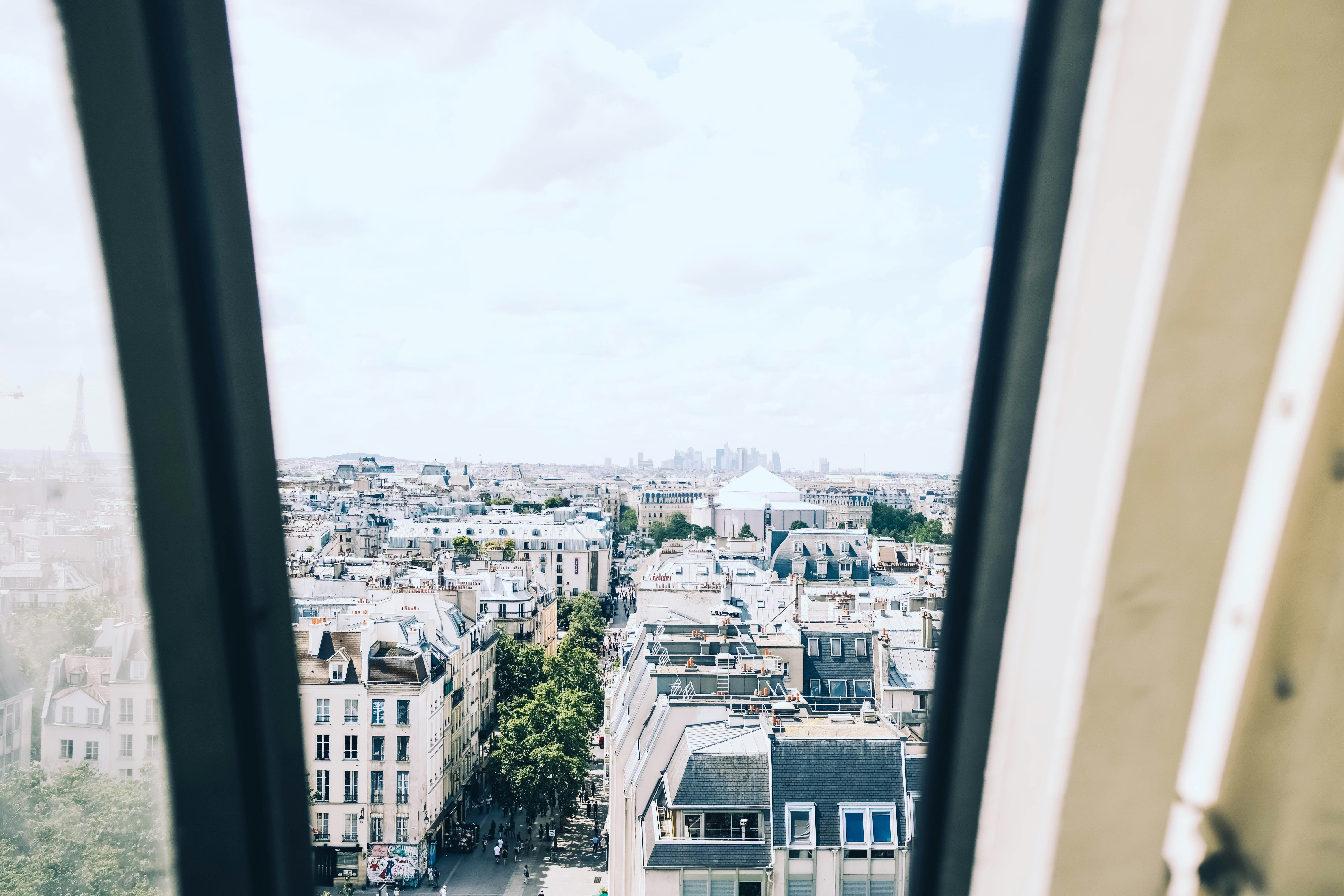 Windowed Cityscape: A Rooftop Perspective through Narrow Frames