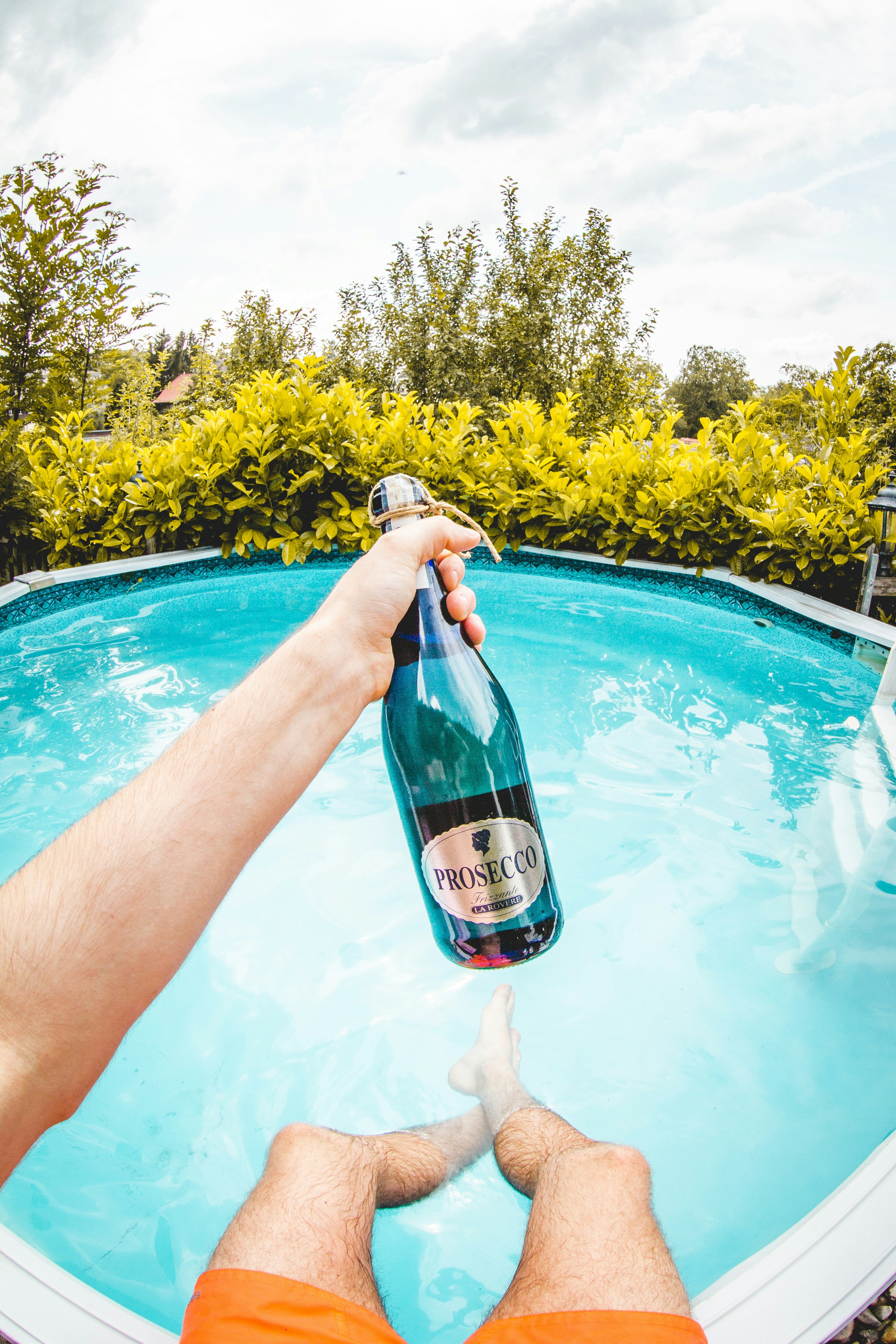 Summertime ☀💥 | person holding Prosecco bottle