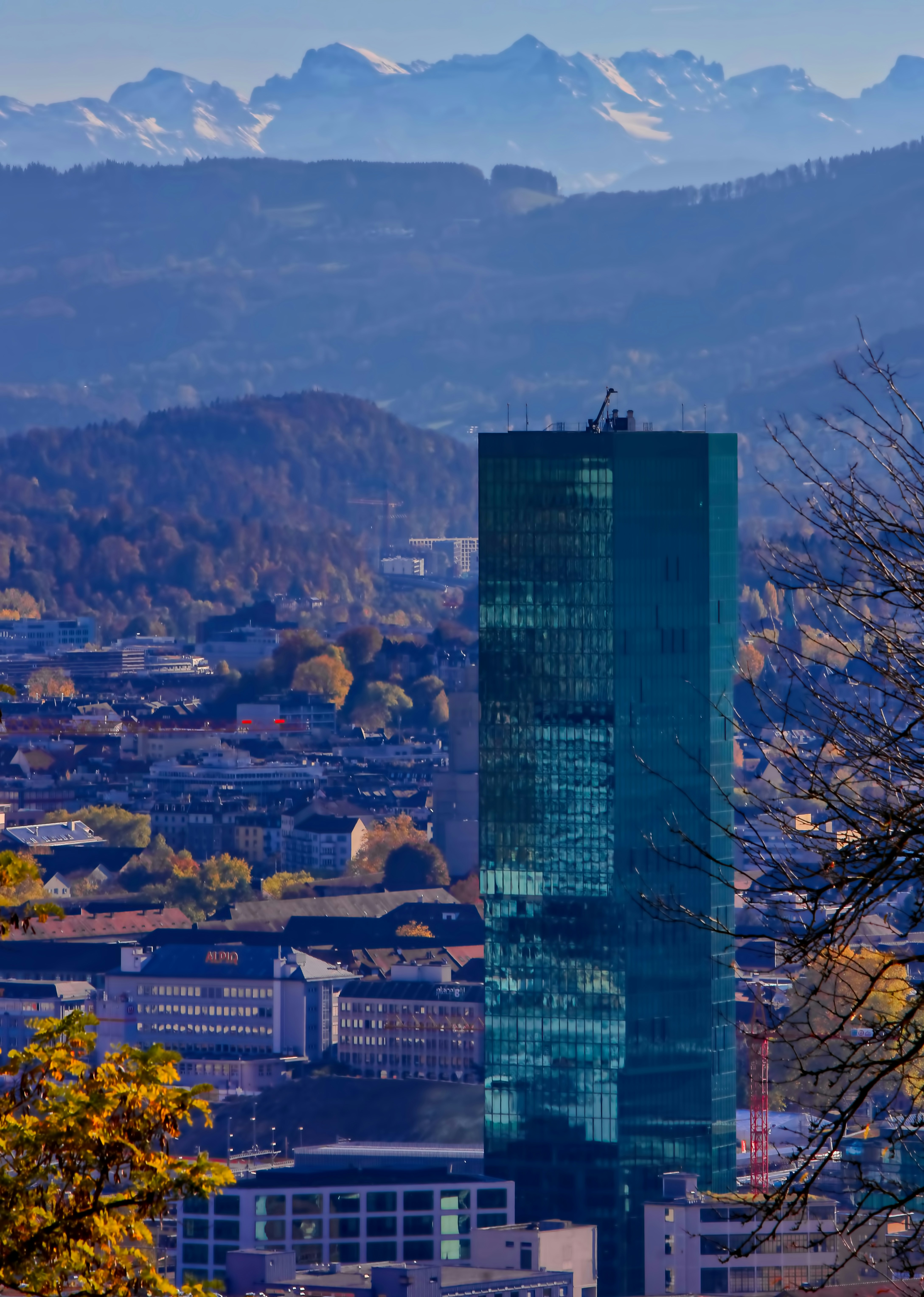 Emerald Prism Over an Alpine City