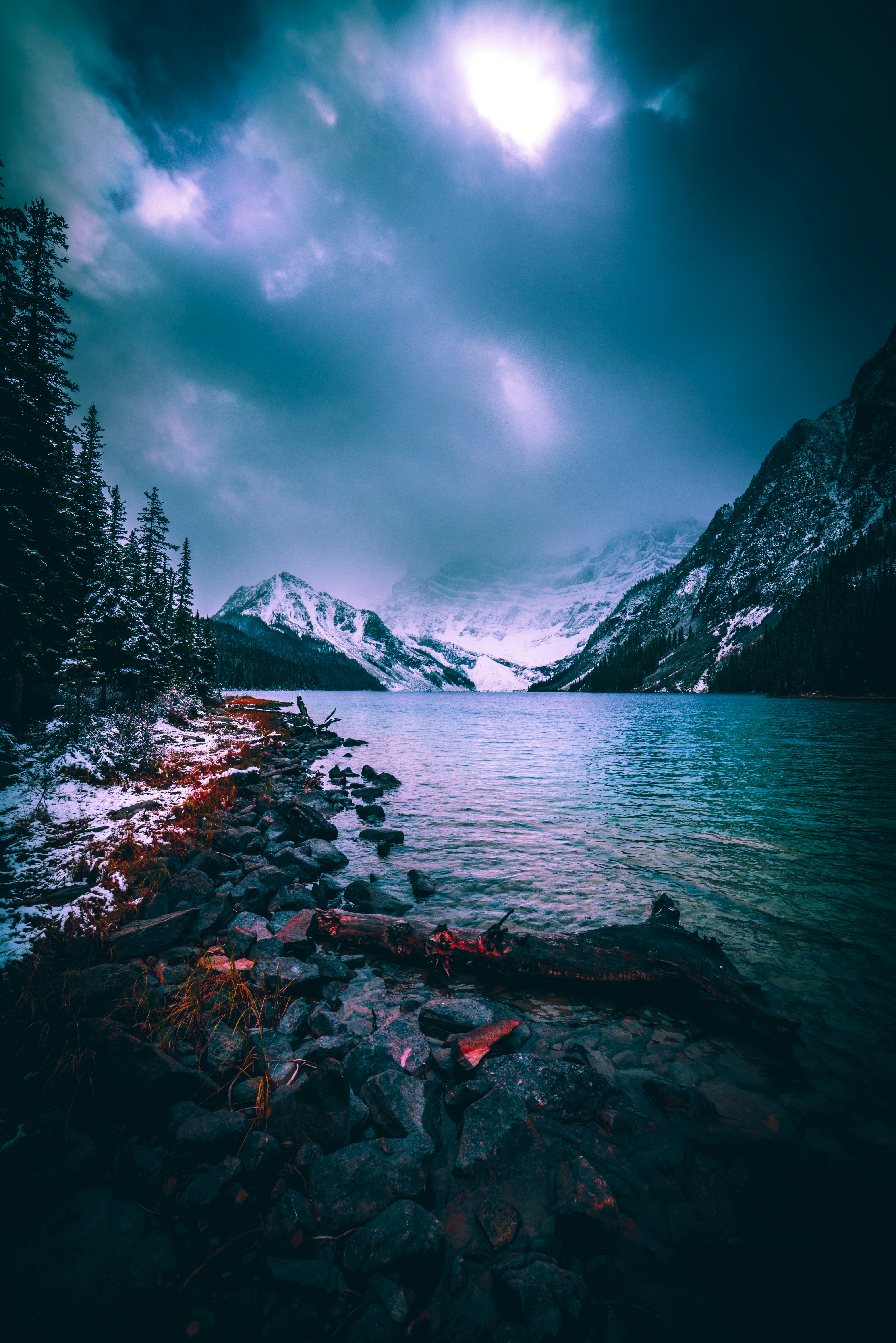 Gray mountain beside body of water photo – Free Canada Image on Unsplash