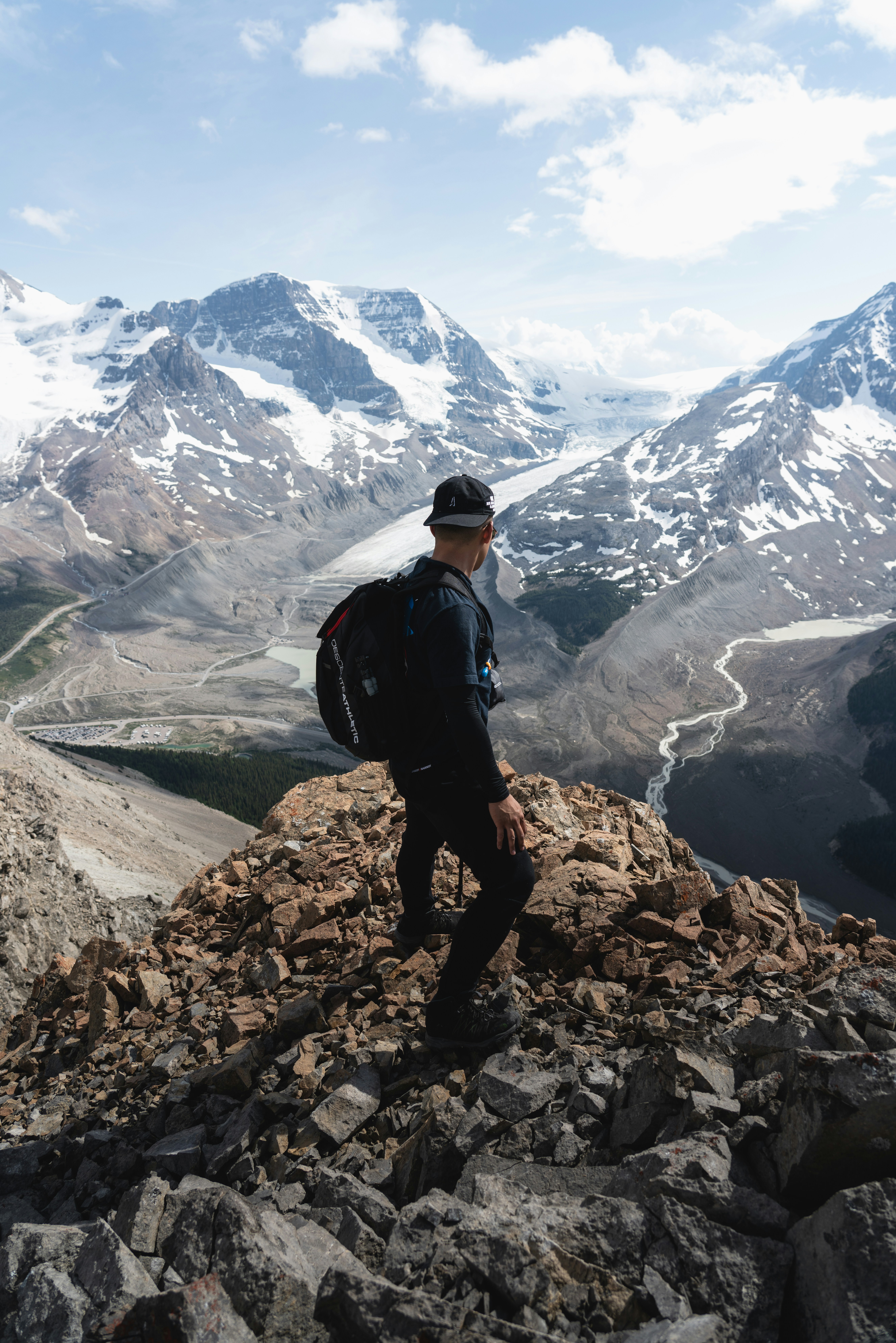 man standing on rock mountain