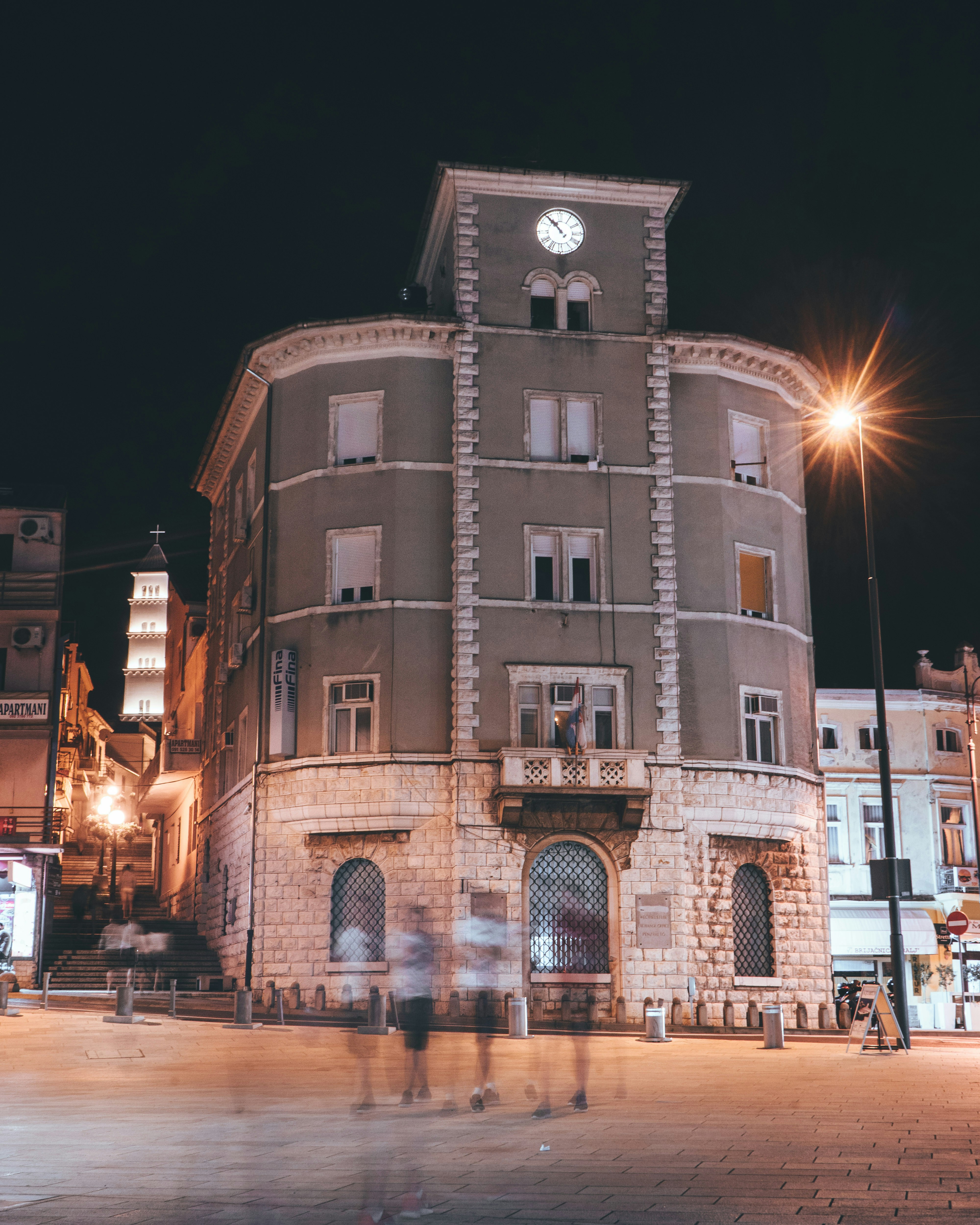 Midnight Clocktower Over a Quiet Plaza