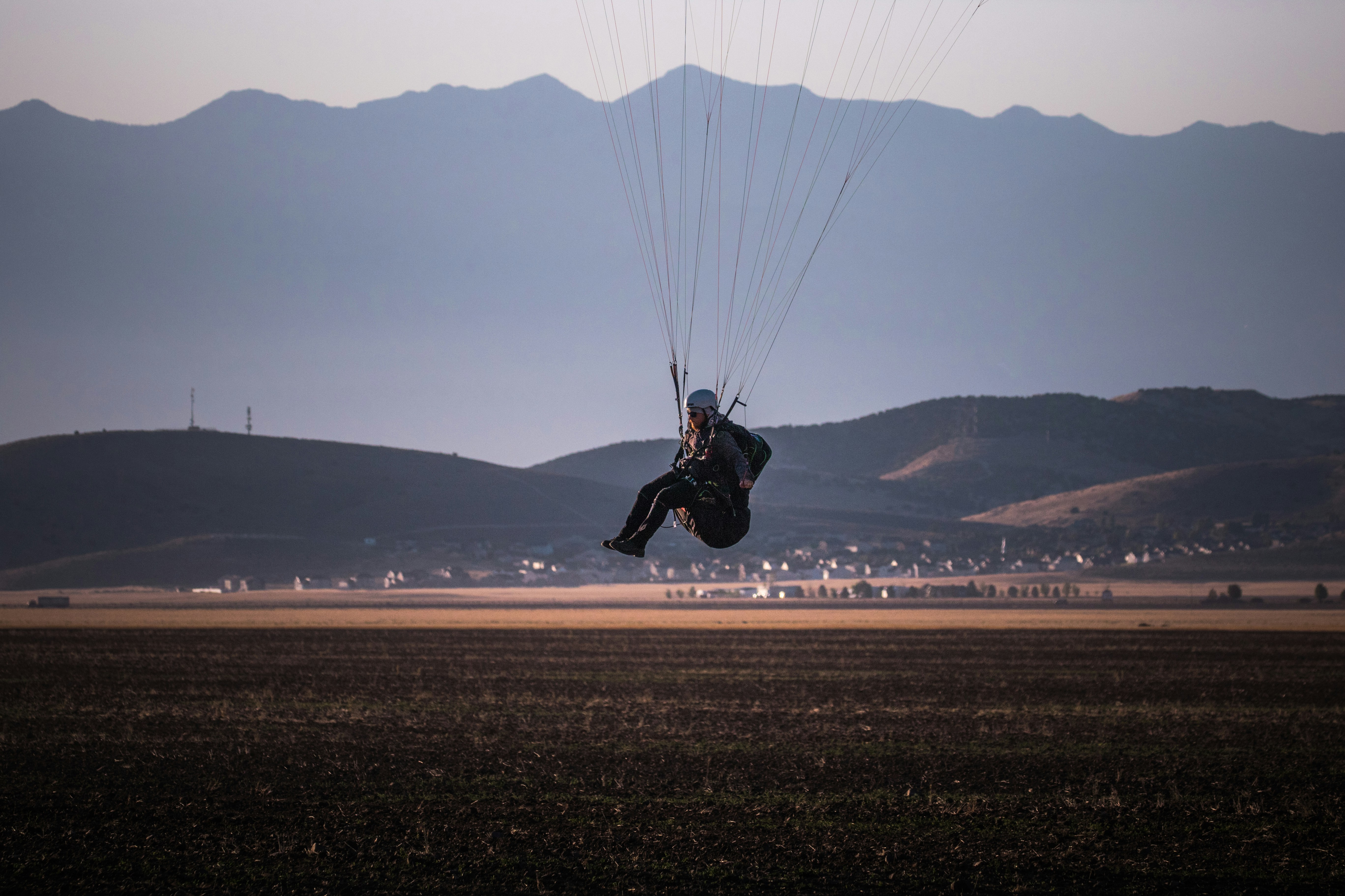 Man in black jacket riding yellow parachute photo – Free Grey Image on ...