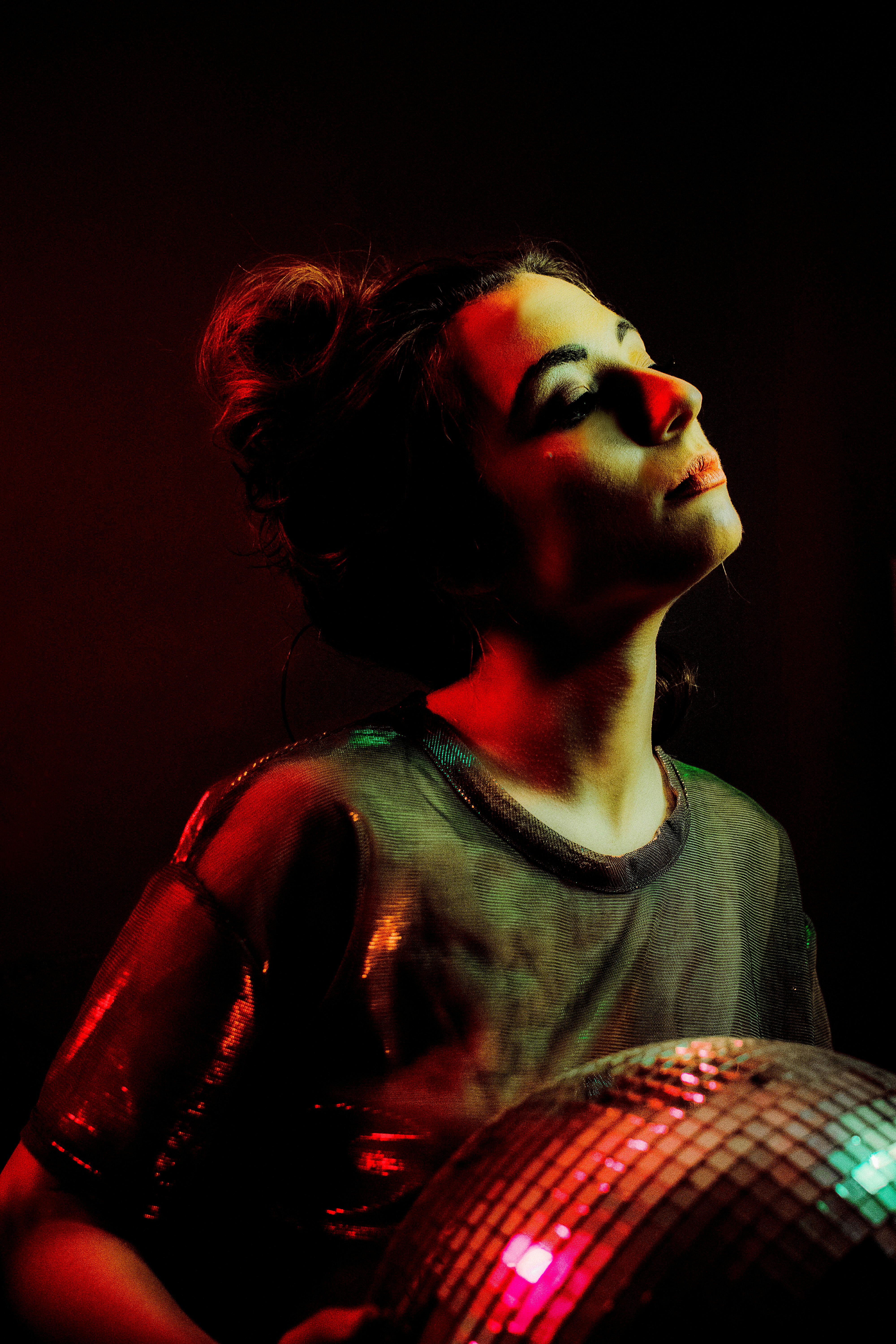 Red-Washed Gaze: A Backlit Portrait in Neon Hue