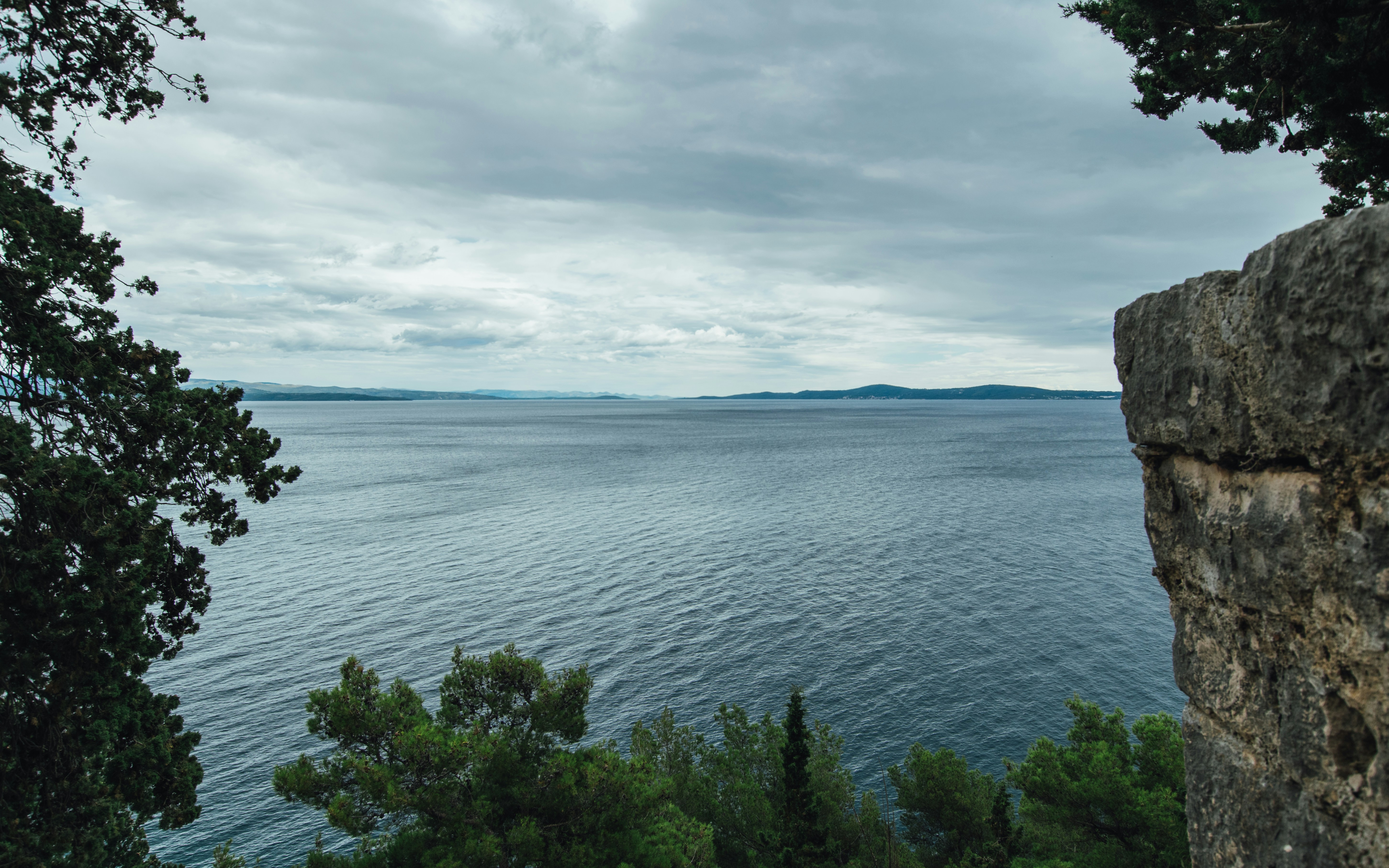 Serene Seascape Between Island Horizons