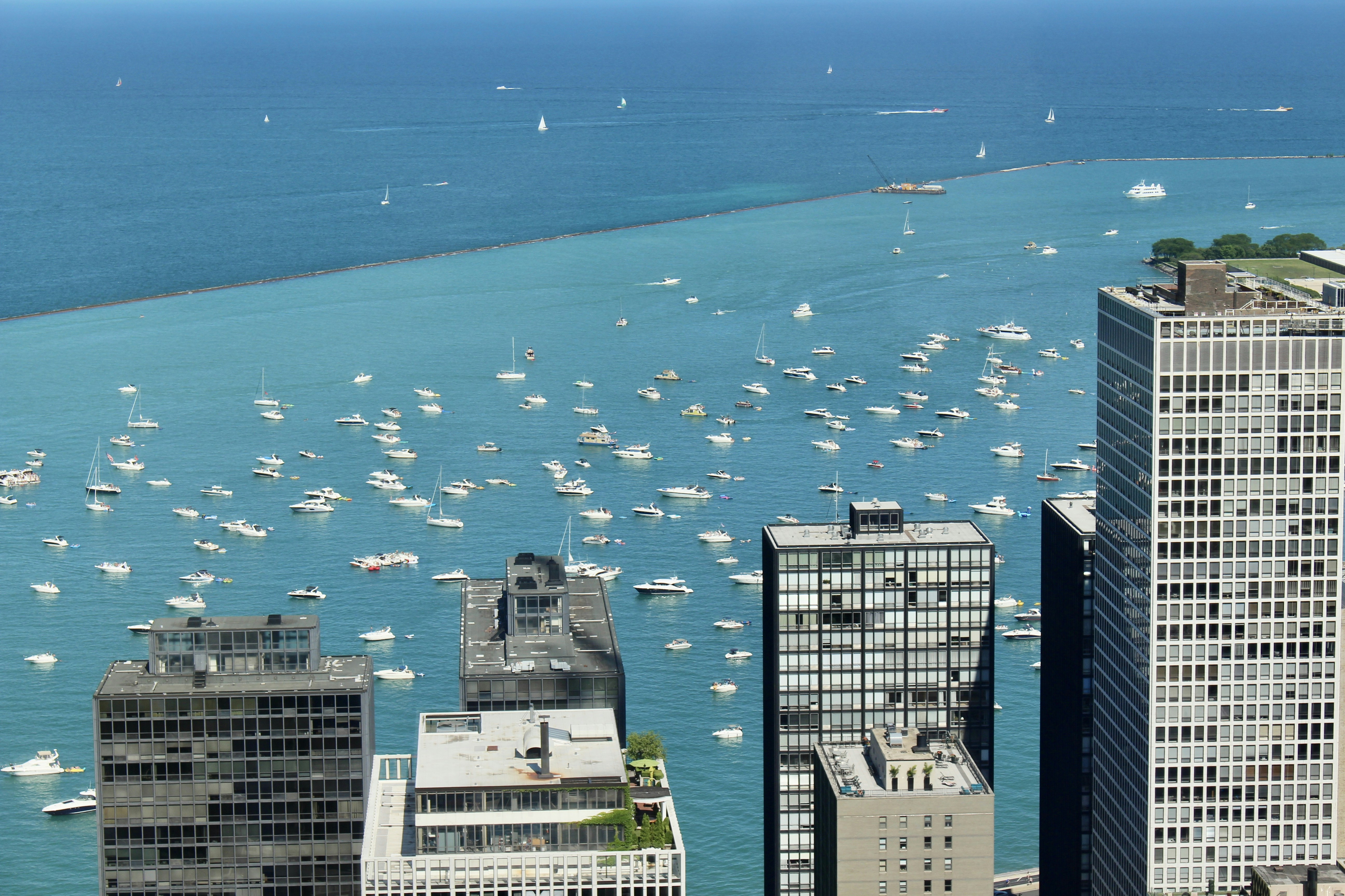 High-rise buildings near sea at daytime photo – Free Blue Image on Unsplash