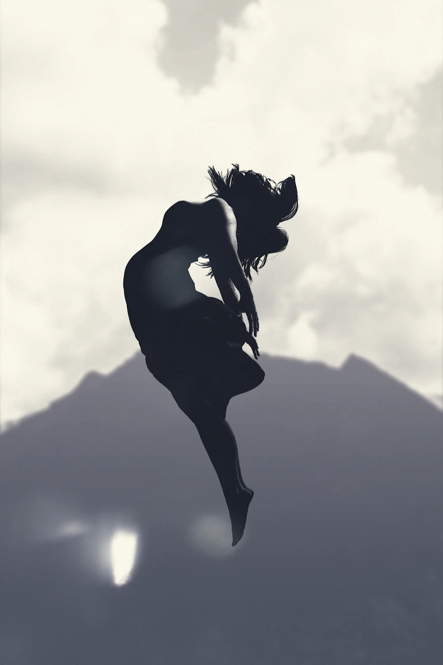 GIVE ME A LIFE | silhouette of person jumping in mid-air during daytime