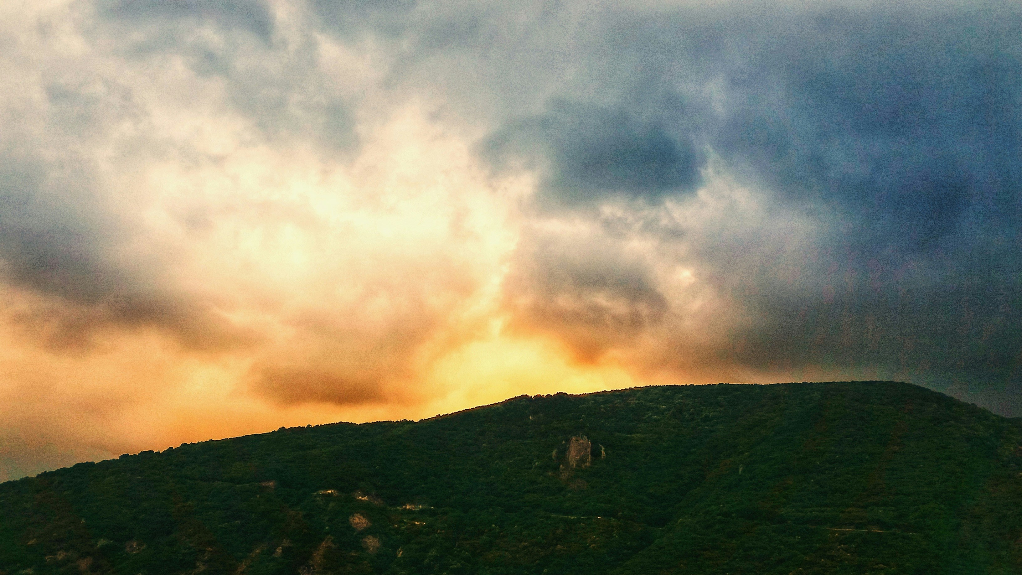 Dramatic Horizon Over Verdant HillsMuhammed Kara