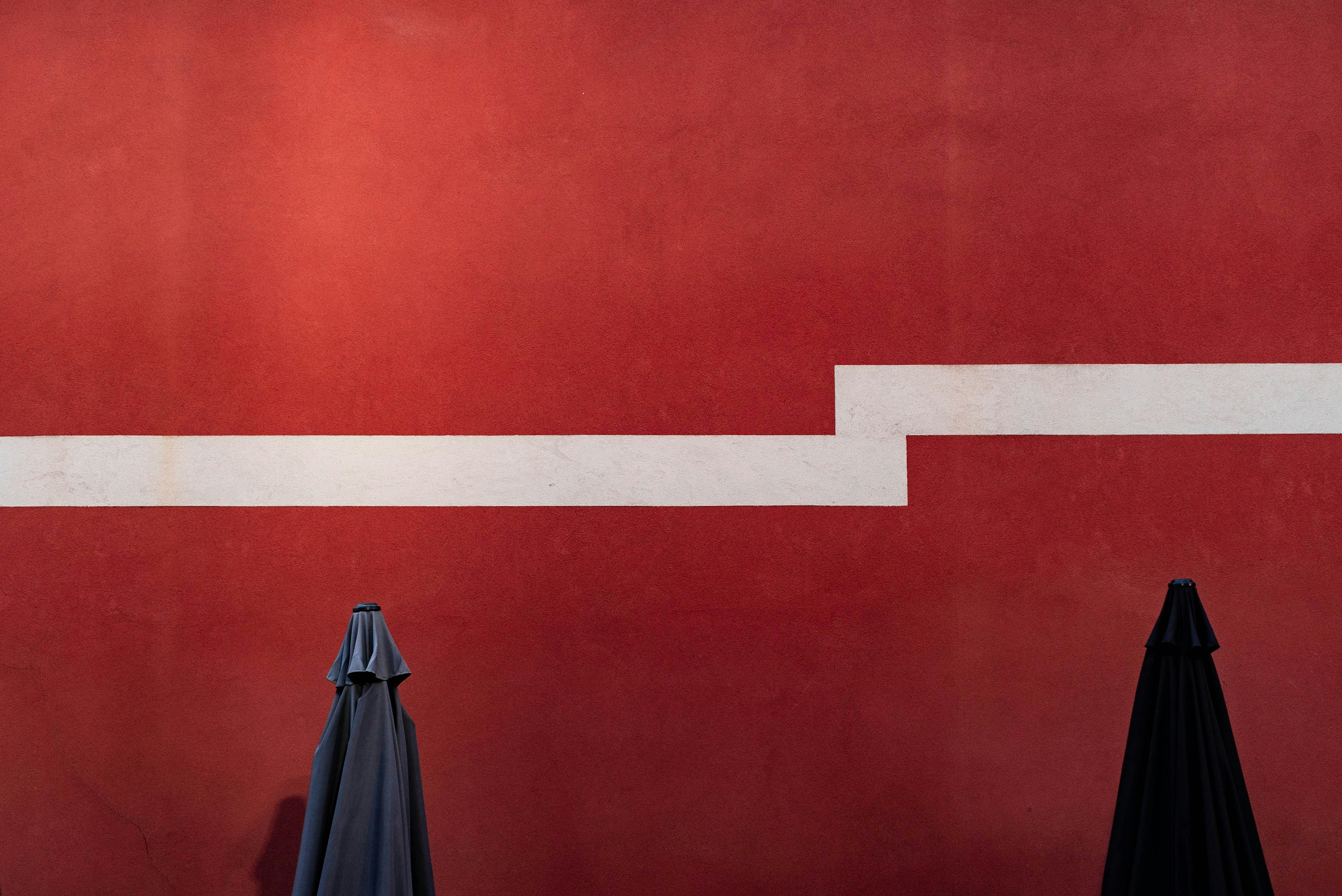 Geometric Contrasts Against a Crimson Canvas