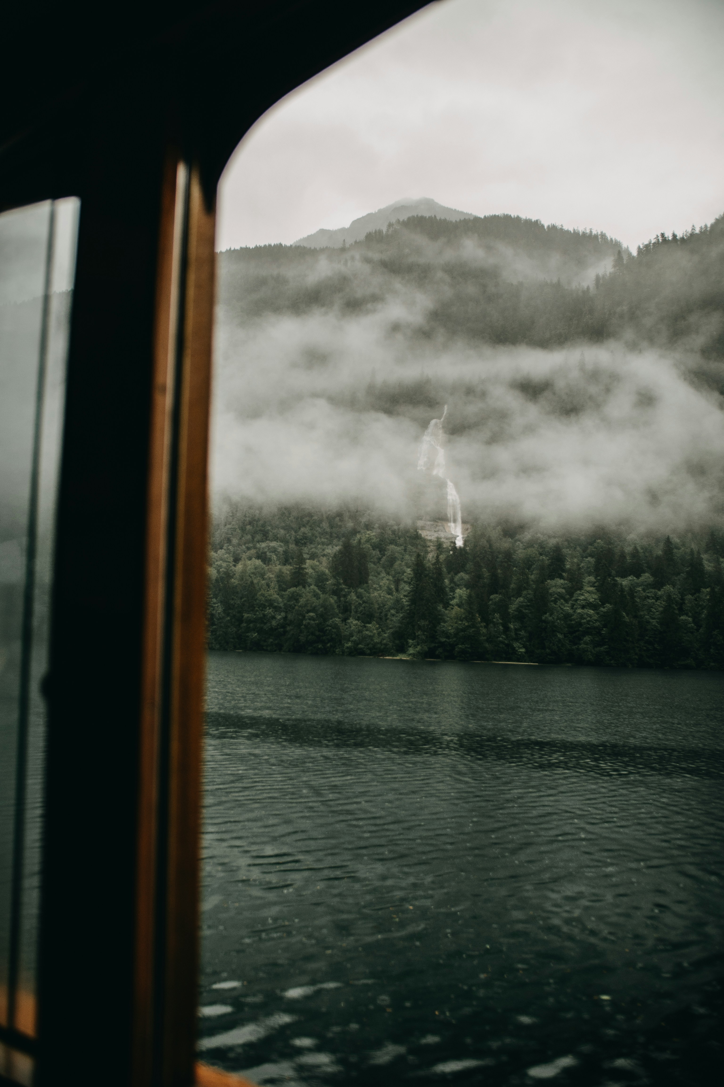 Fogged Peaks Seen Through a Vessel Window