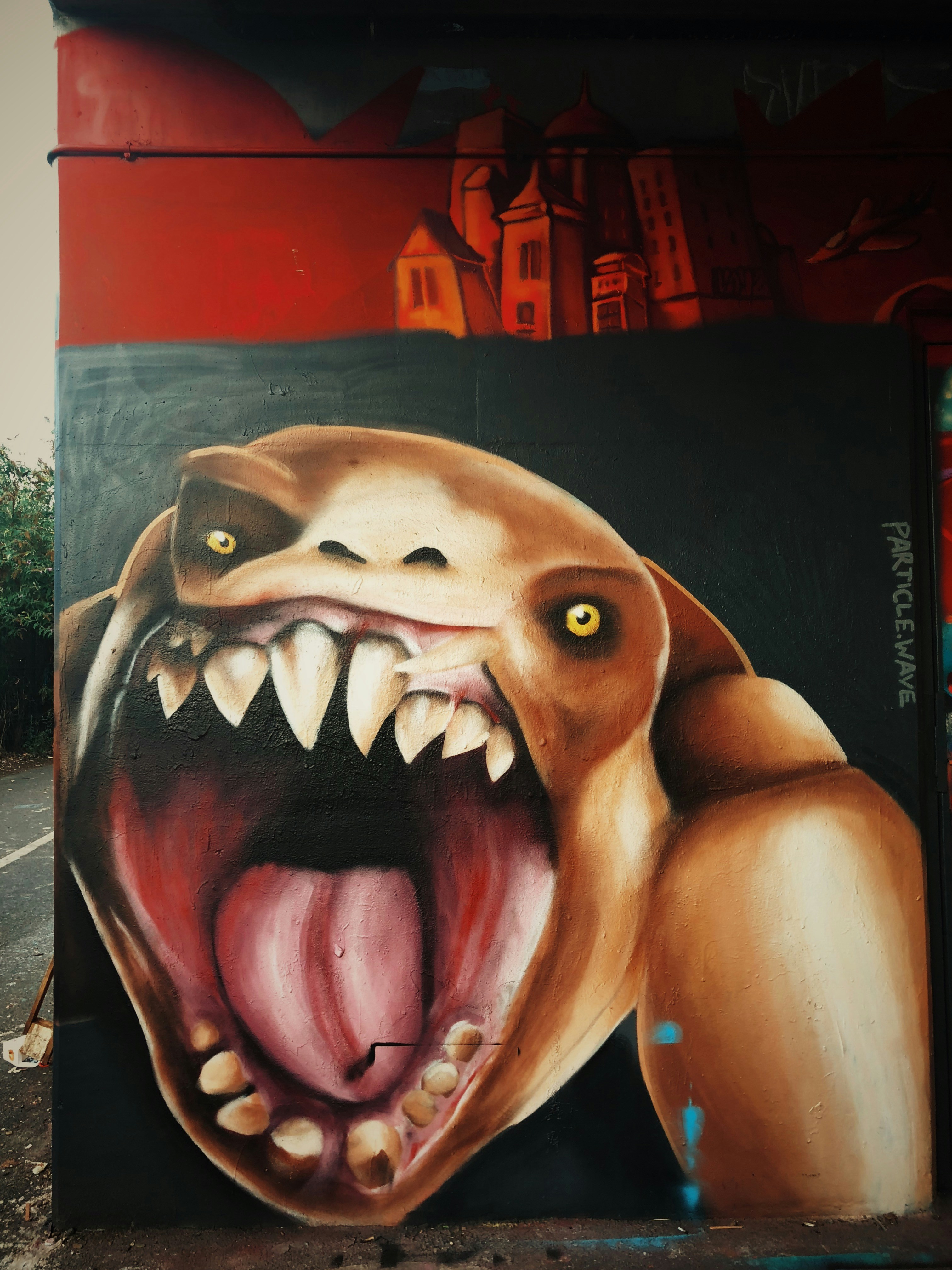 Urban Maw: A Giant Graffiti Monster Stares from the Wall