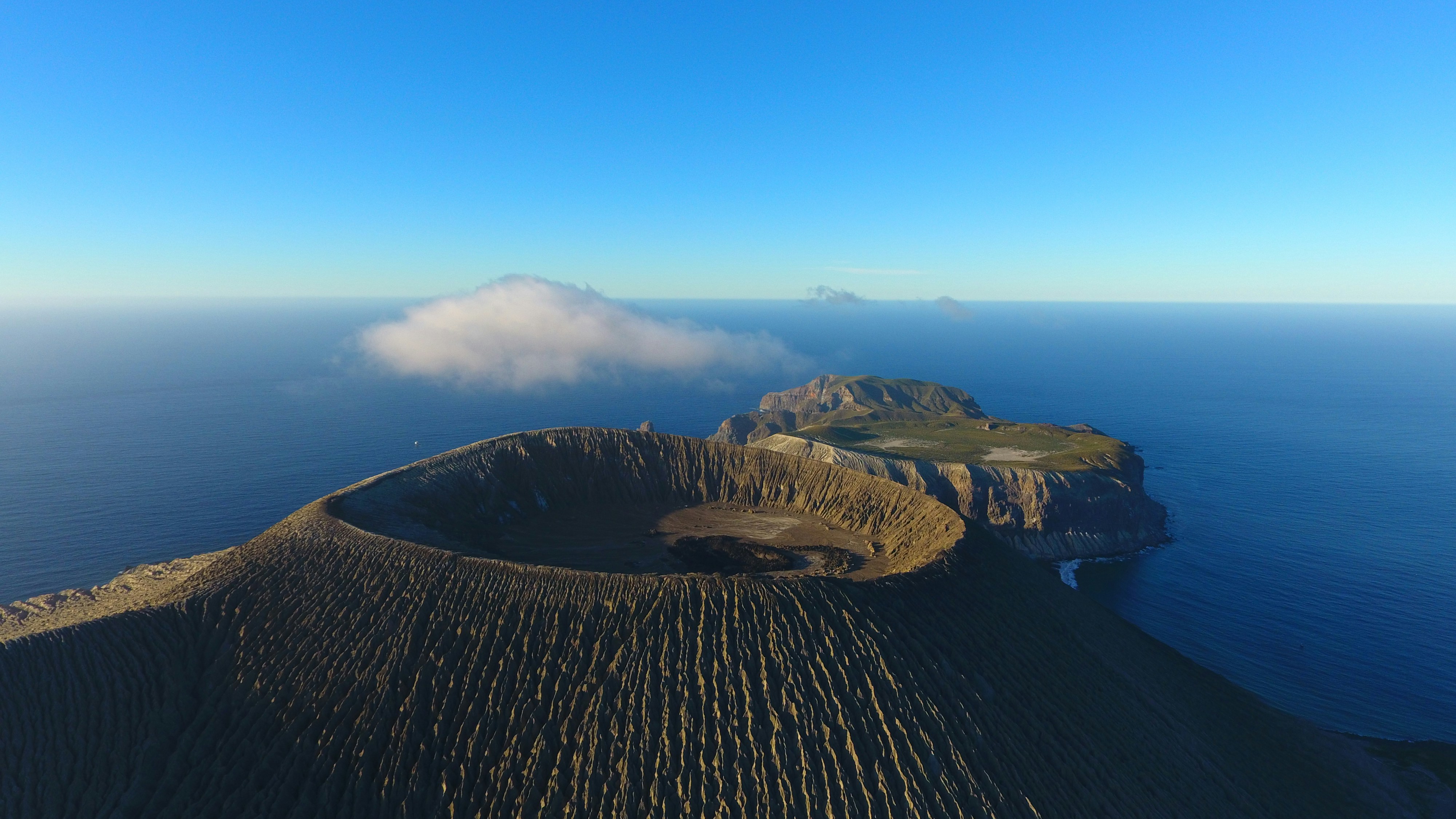 Volcanic Majesty Over Oceanic Horizon
