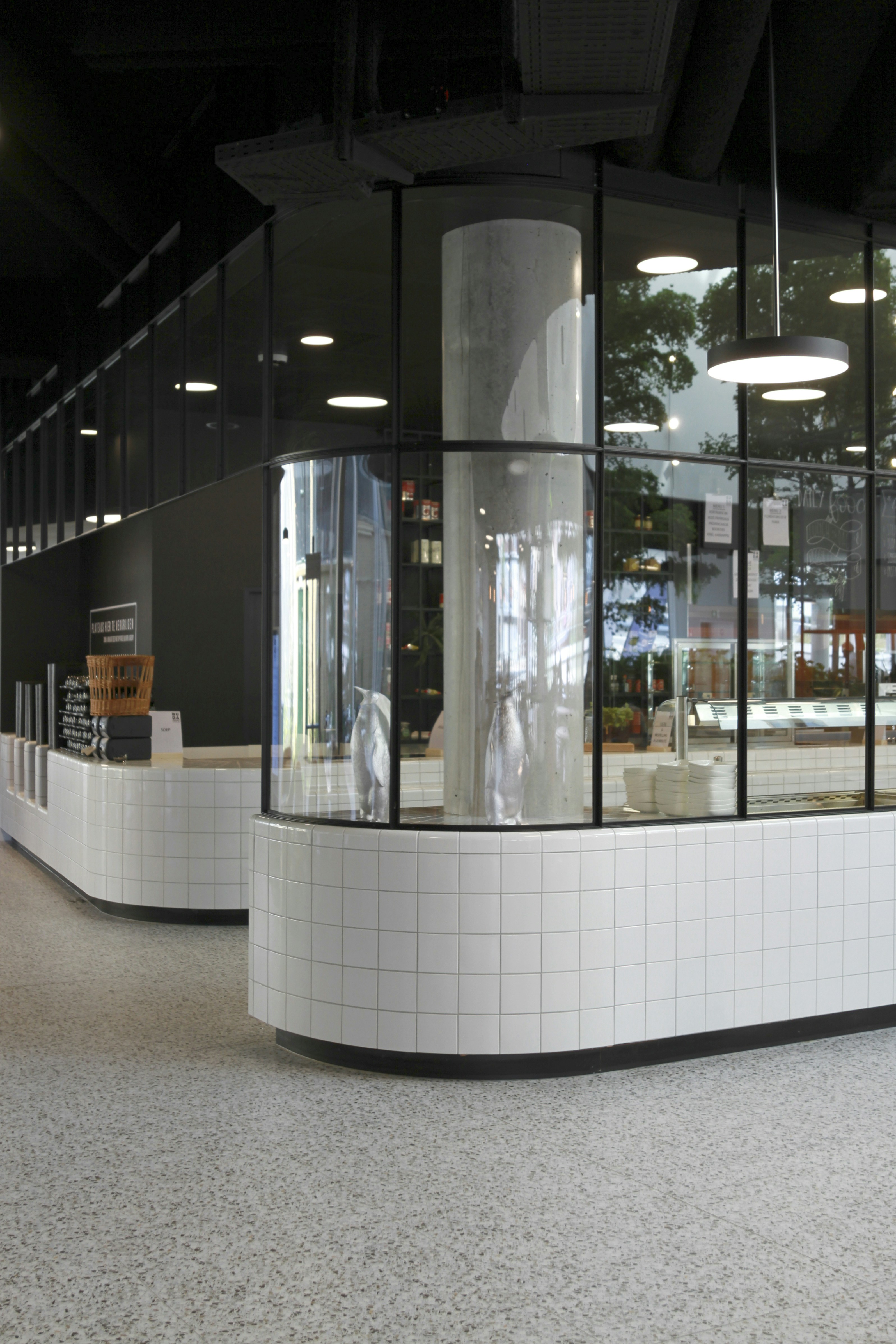 The Curve of Glass: Quiet Light in a Modern Café Interior
