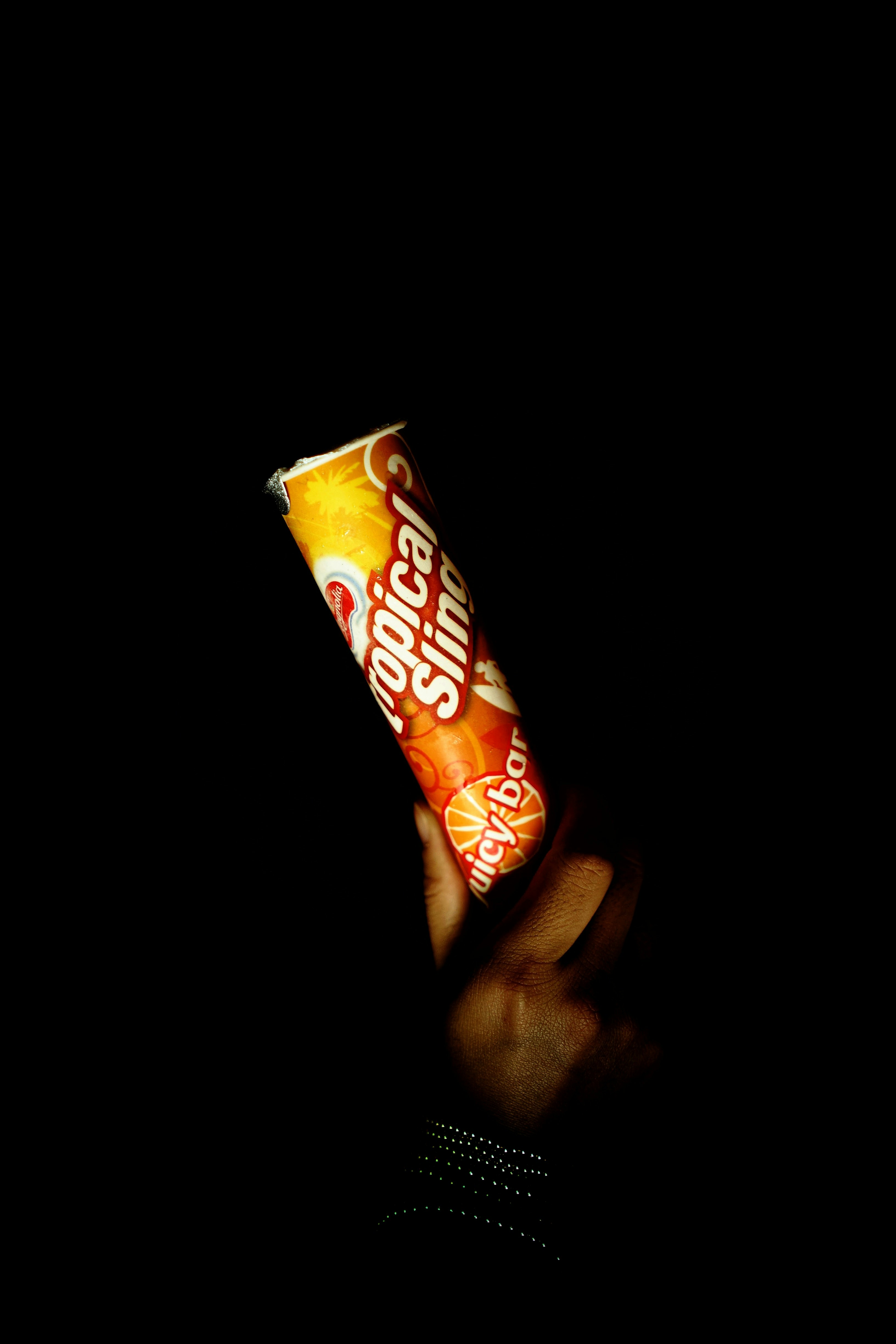 Illuminate the Snack: A Luminous Juicy Bar Clutched in the Dark