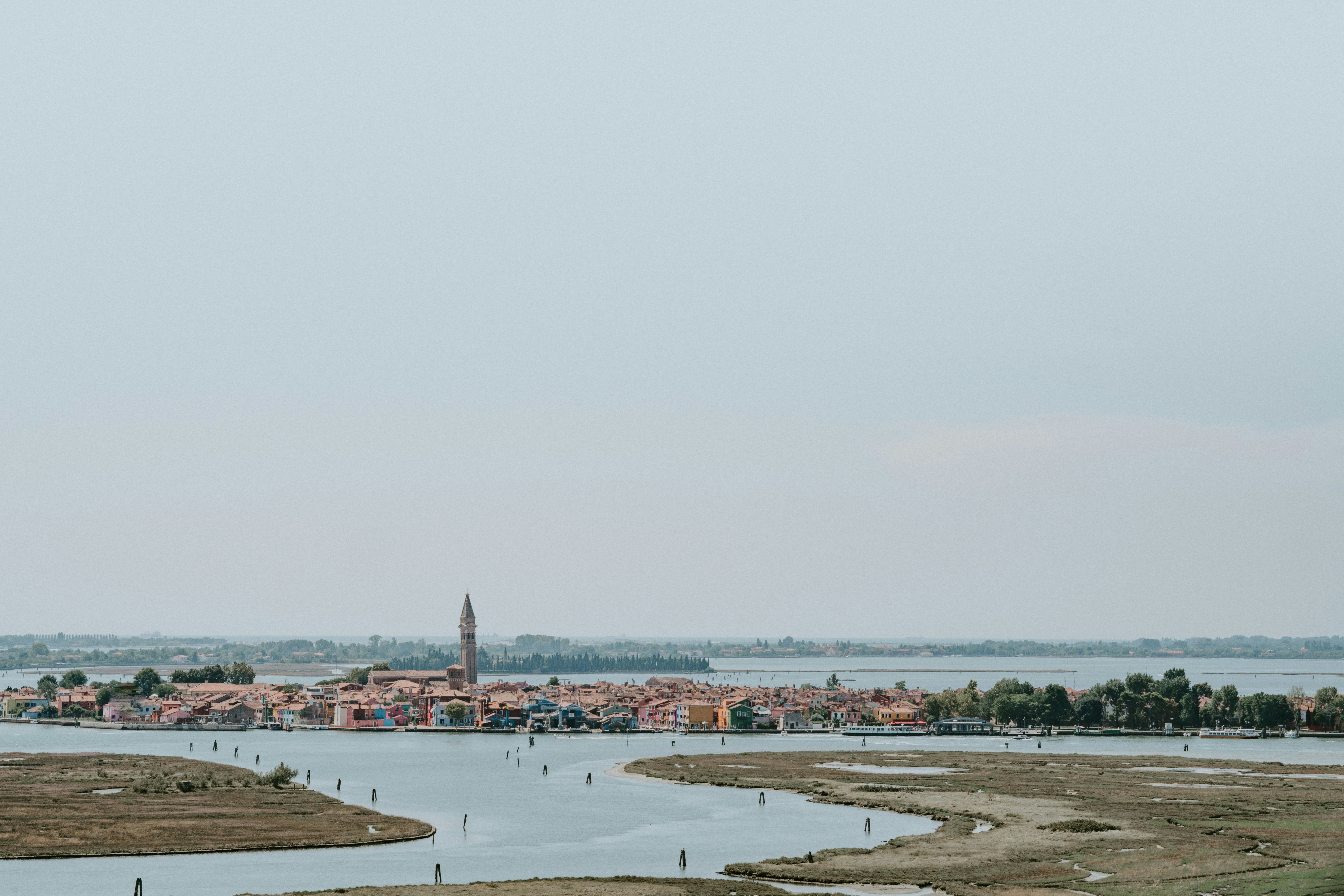 Building above water under white clouds and blue sky photo – Free ...