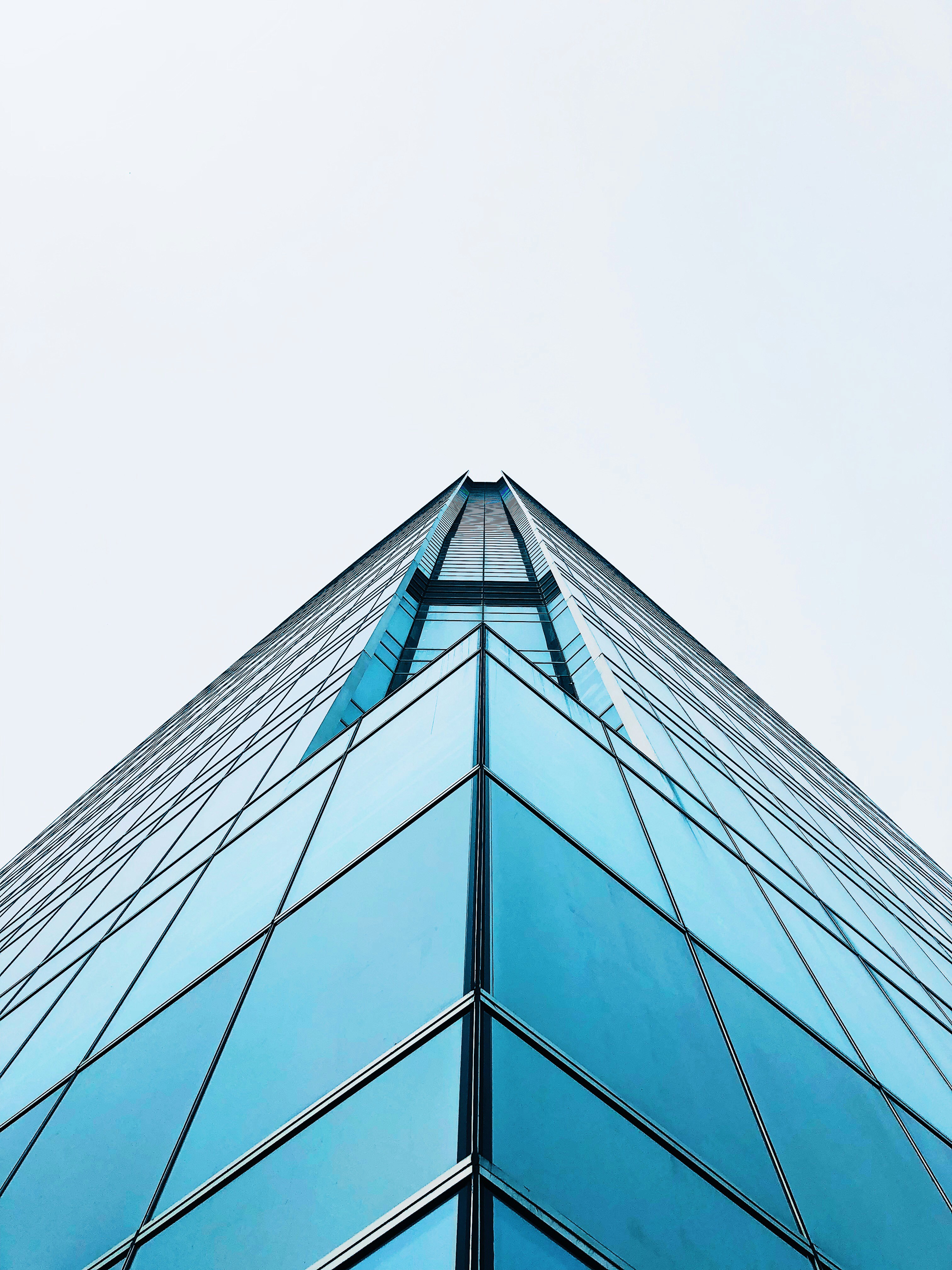 A very tall glass building with a sky background photo – Free Santiago ...
