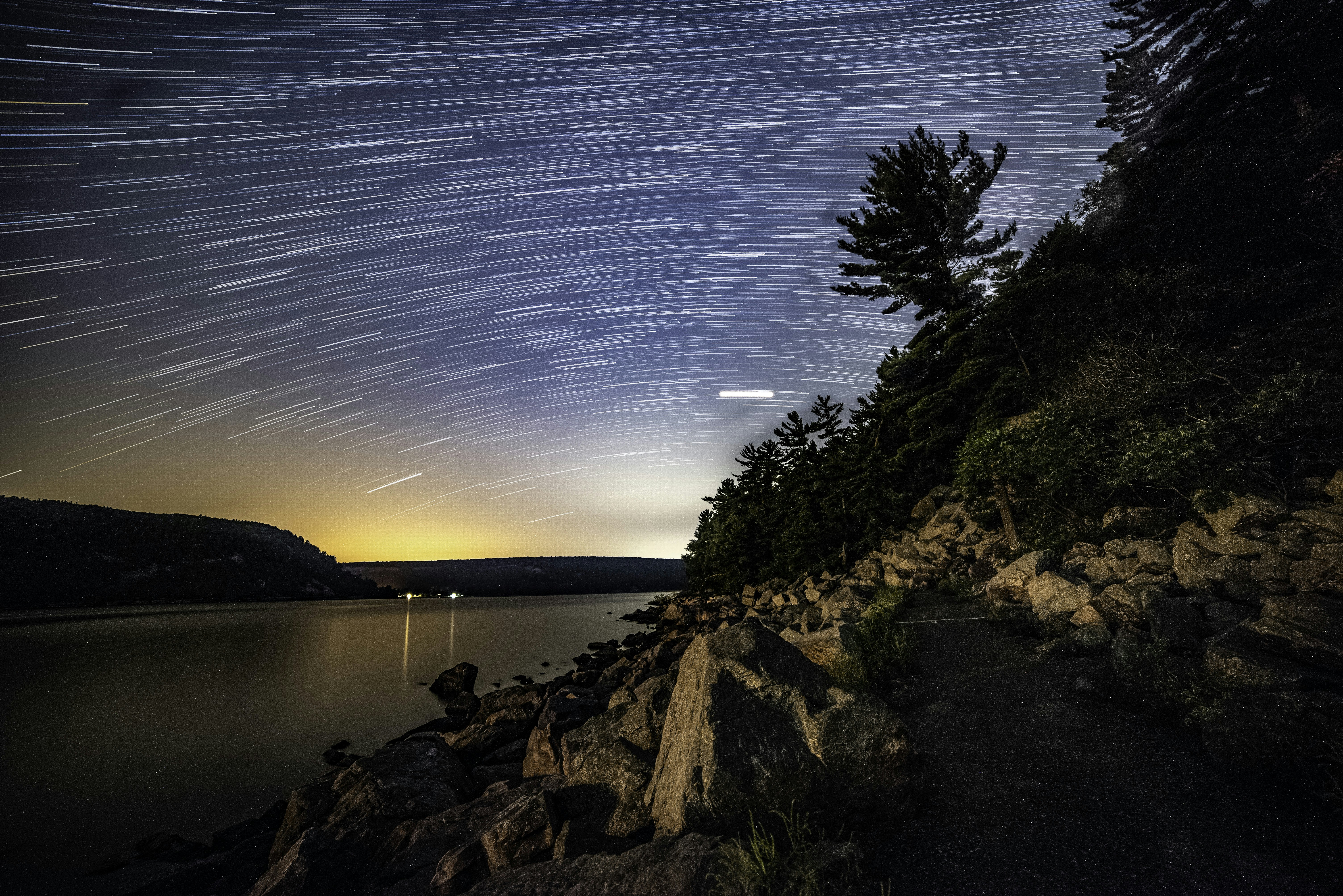 Star-Stitched Silence: Trails Over a Rocky Lakeshore