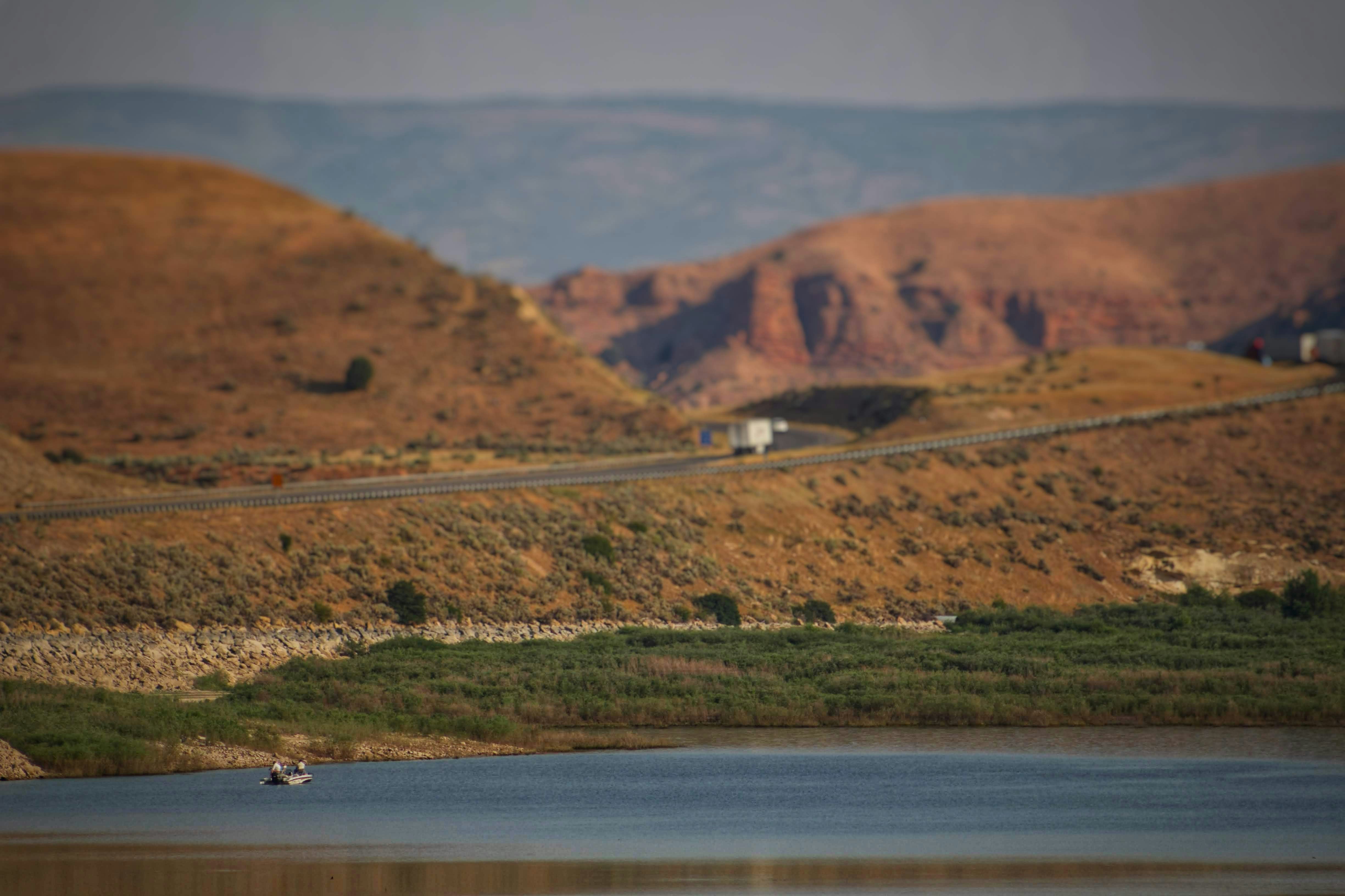 A body of water with hills in the background photo – Free Echo ...