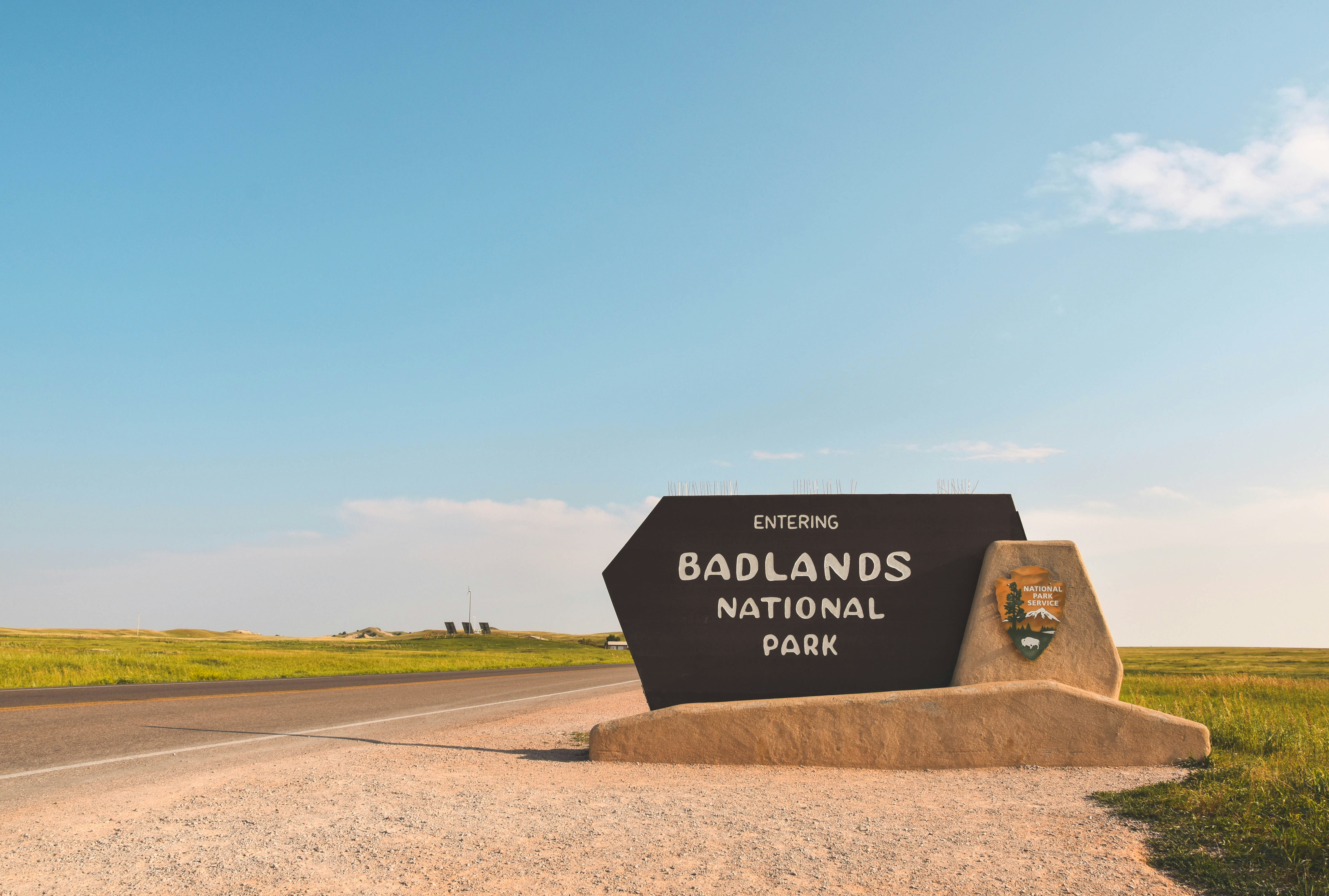 Black Badlands National Park road sign beside road photo – Free ...