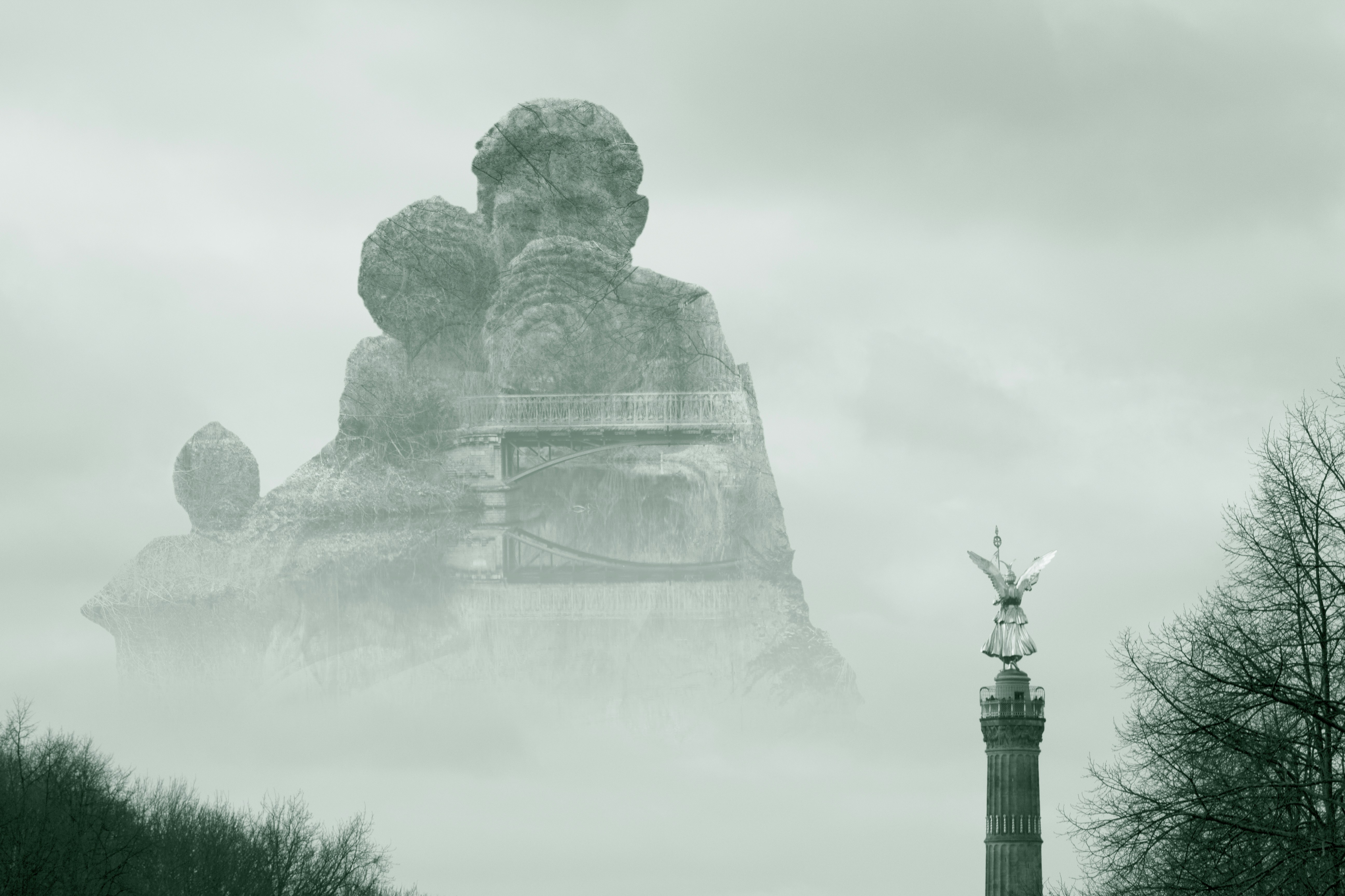 Misty Monument: The Angel and the Colossal Carved Face Emerging from Fog