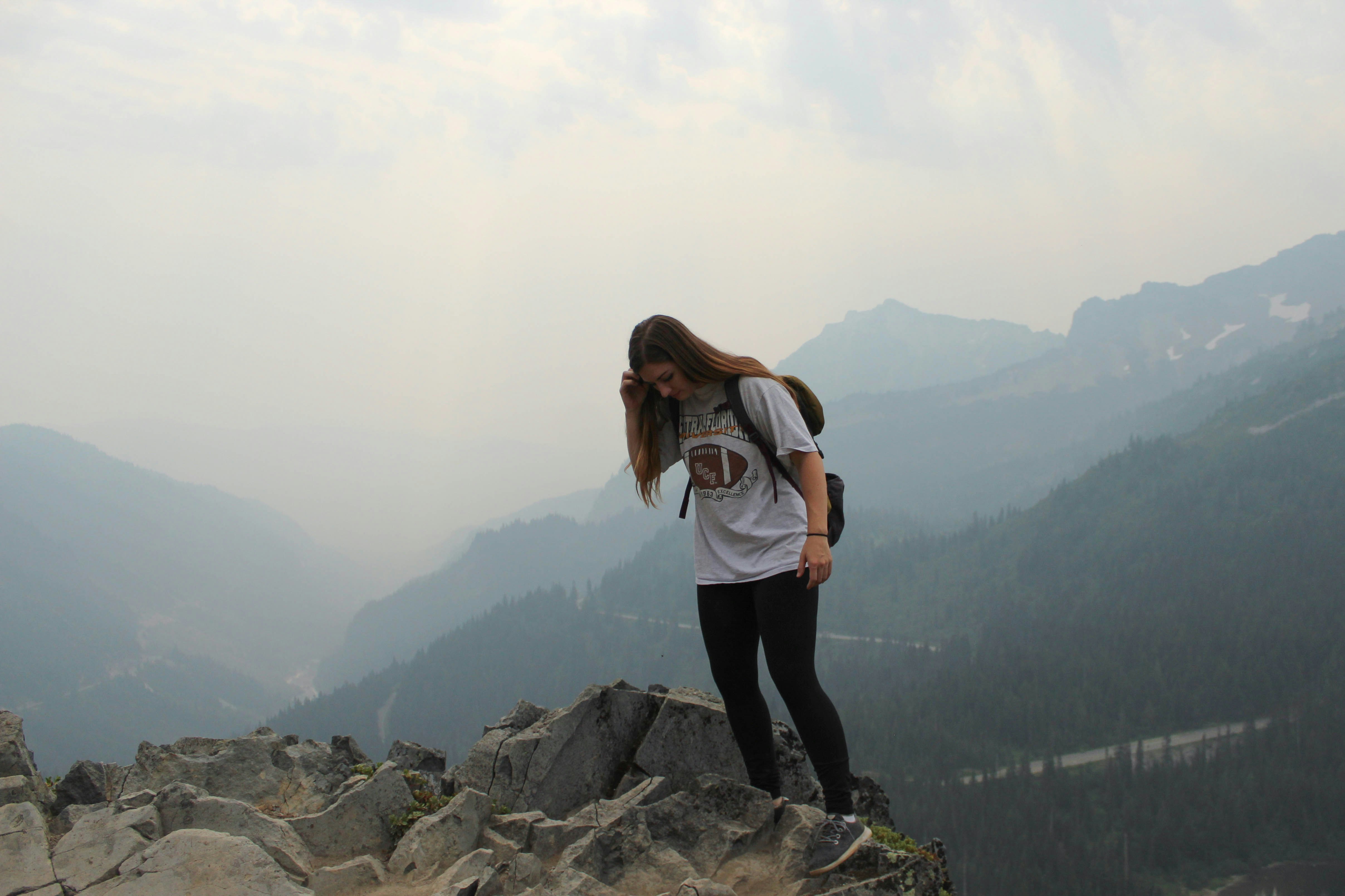 Woman standing on cliff photo – Free Forest Image on Unsplash