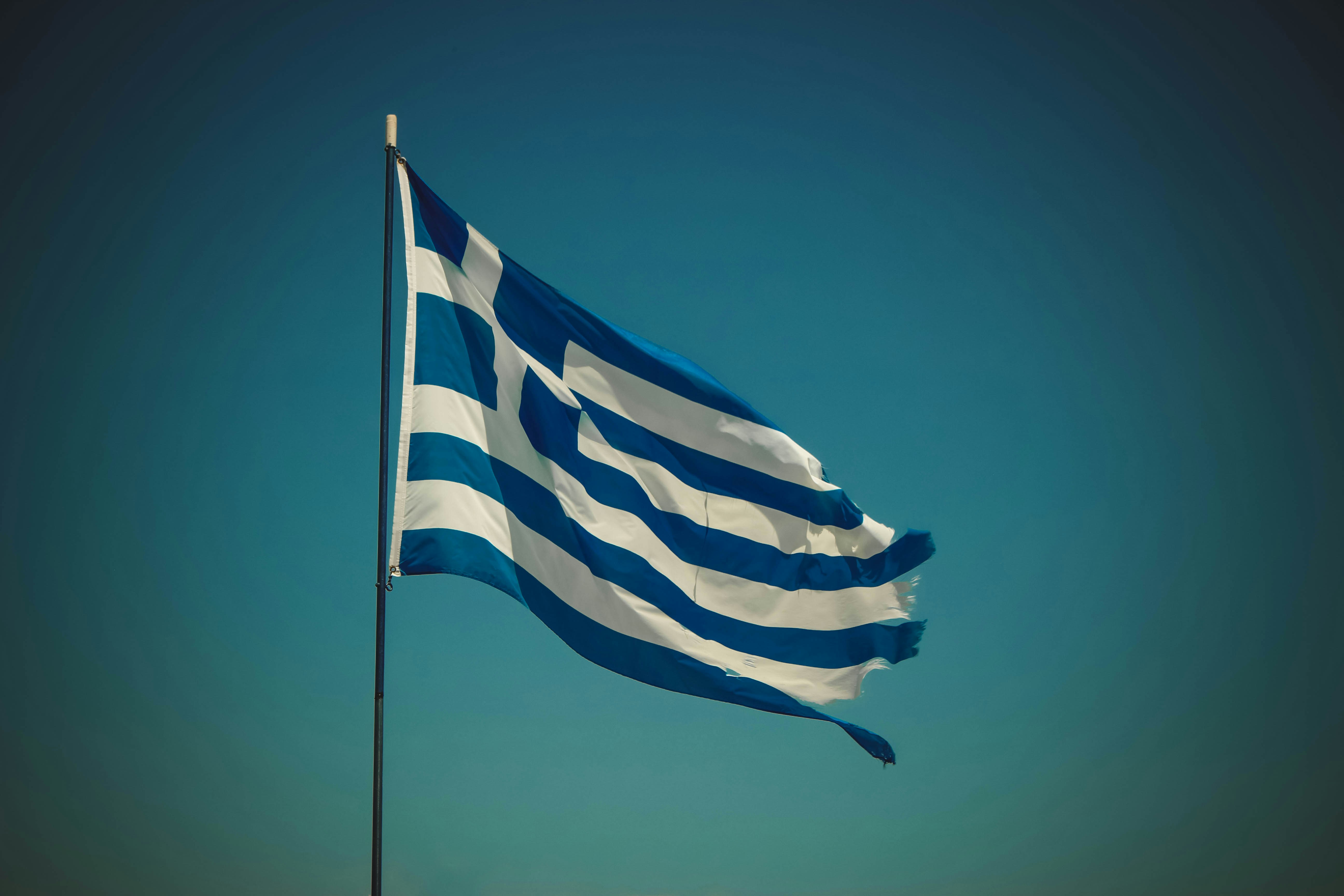 Blue and white striped flag placed on pole photo – Free Corfu Image on ...