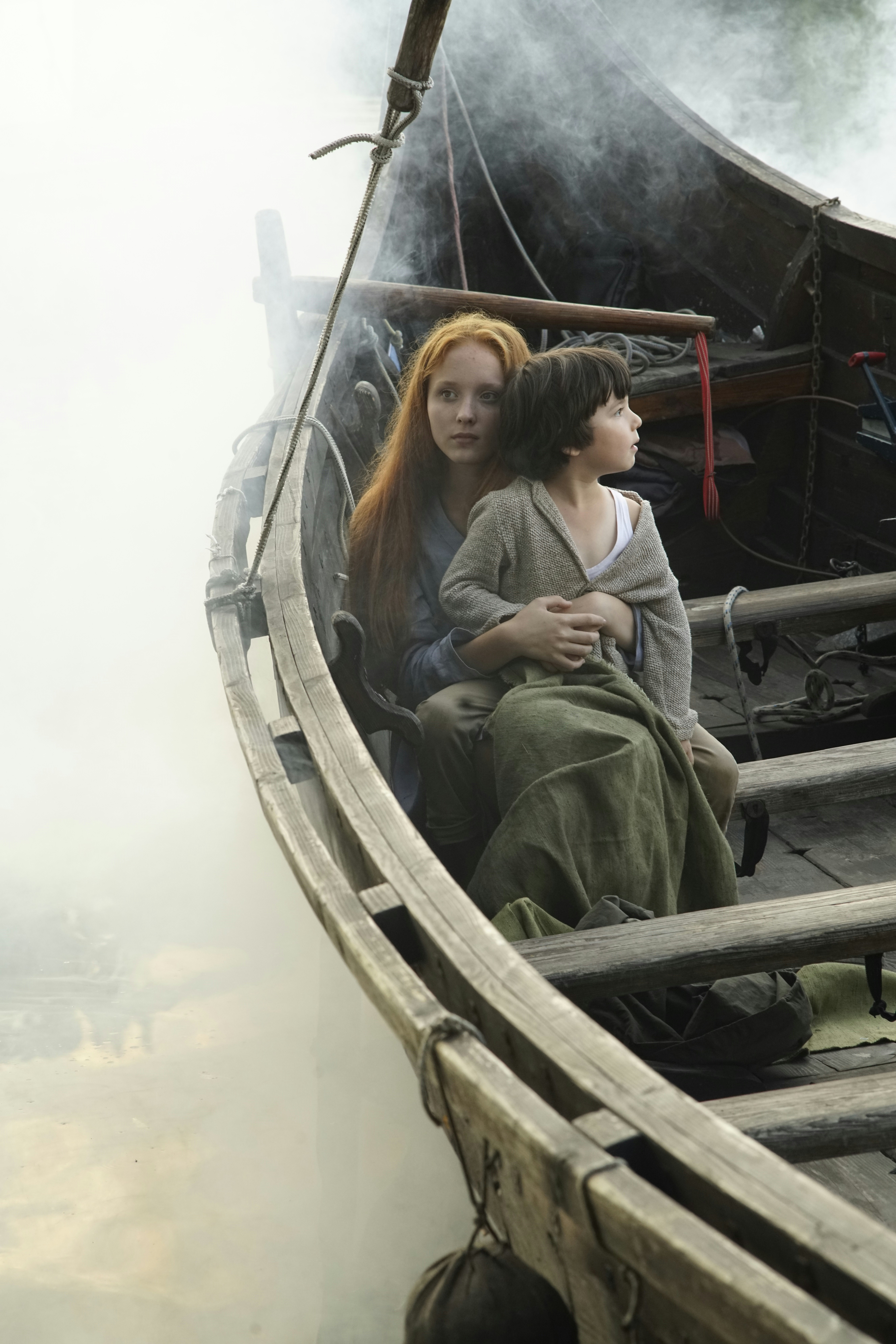 Smoke-Cloaked Timber Boat: A Quiet Bond Between Siblings