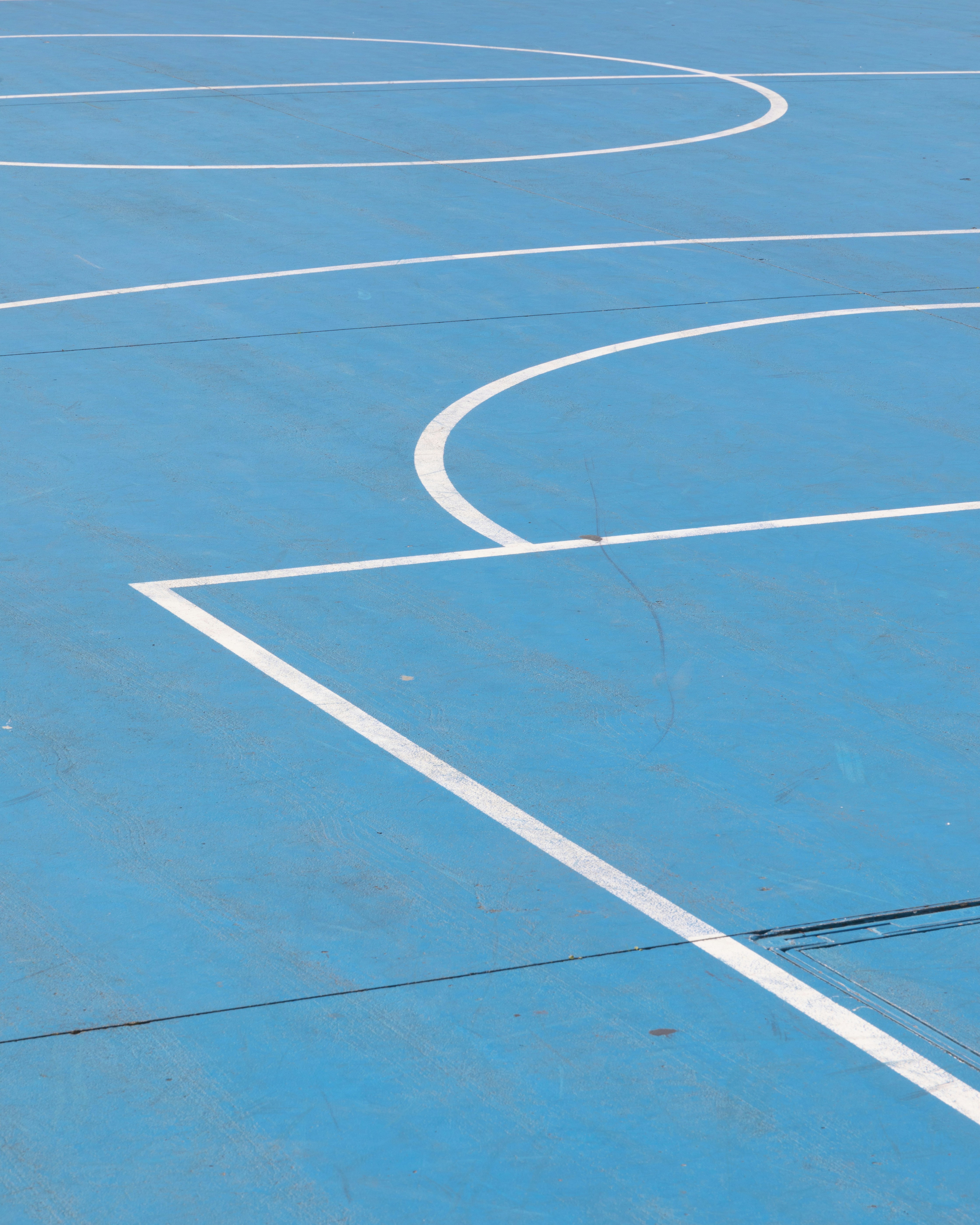 Field | white line on blue basketball floor