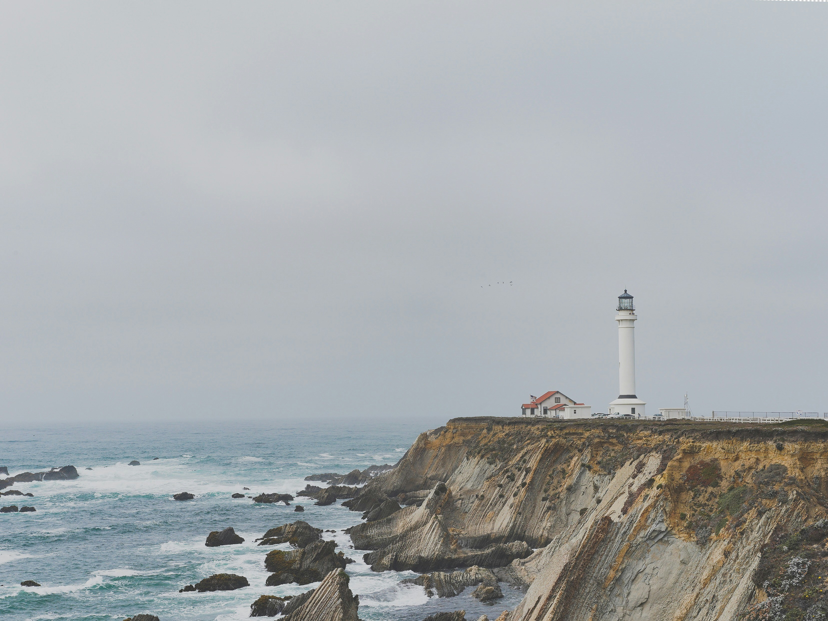 Lighthouse on cliff photo – Free United states Image on Unsplash