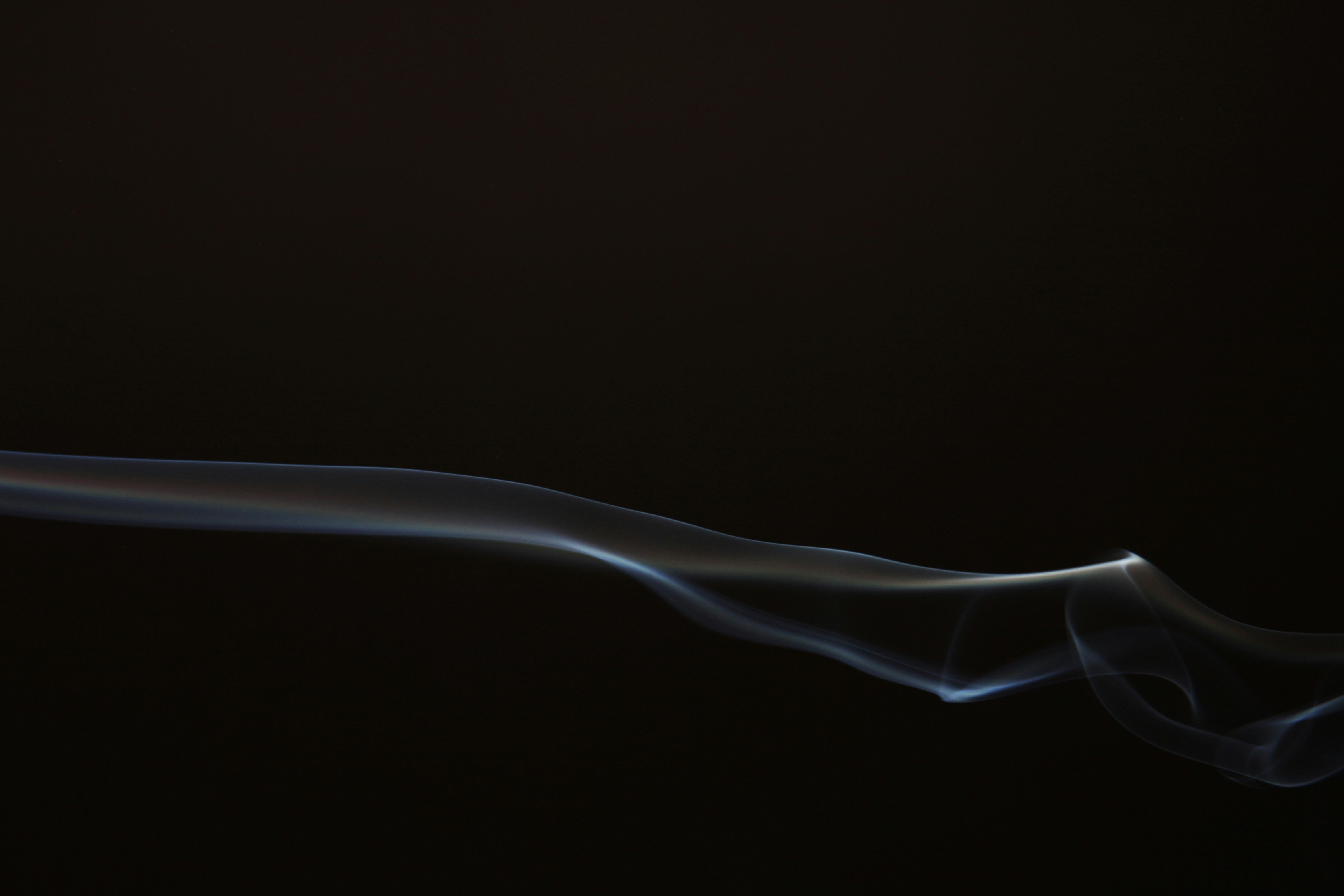 A long smoke trail on a black background photo – Free Smoke Image on ...