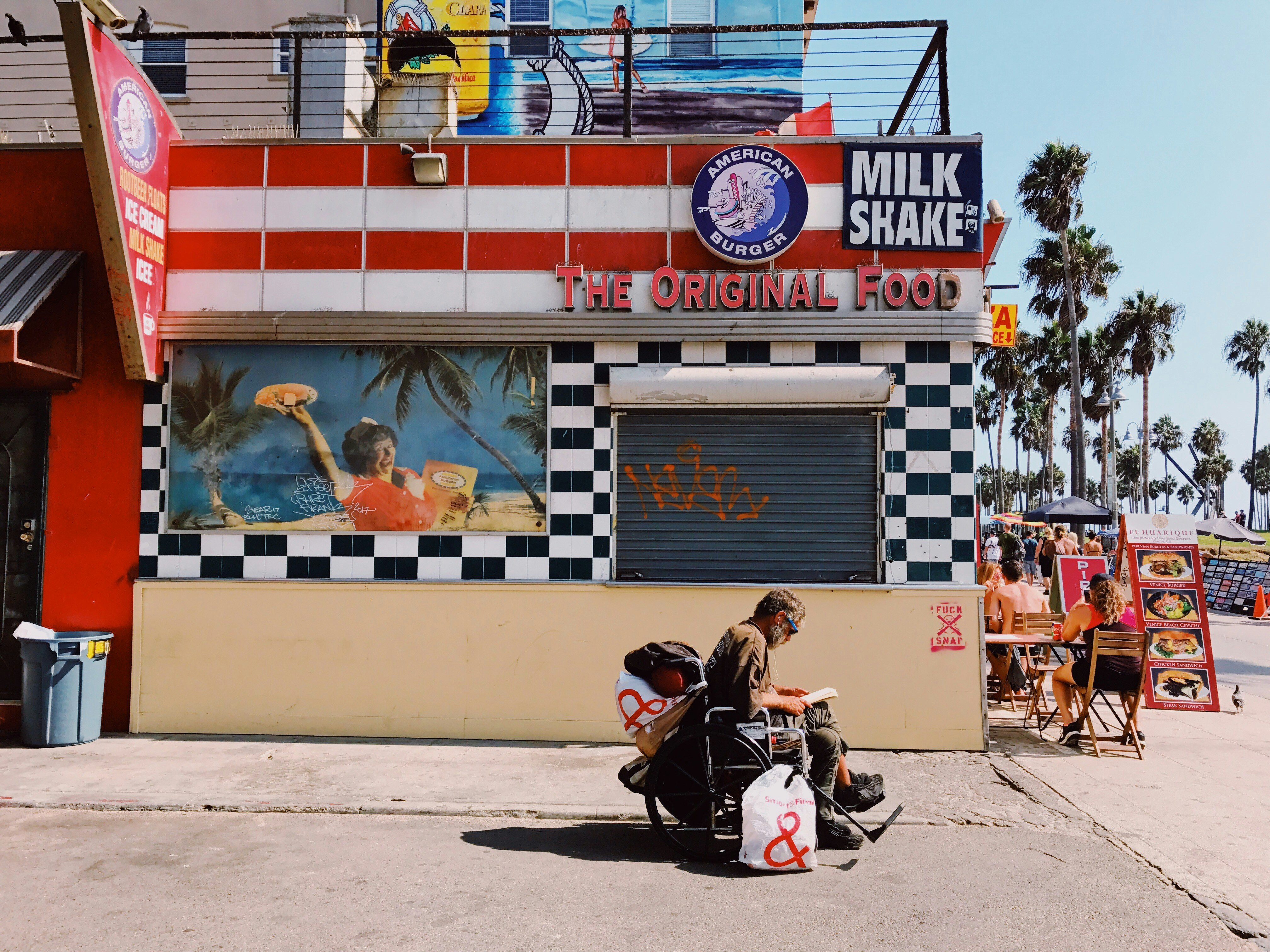 Scooter by the Neon Boardwalk: A Small Scene at a SoCal Snack Stop