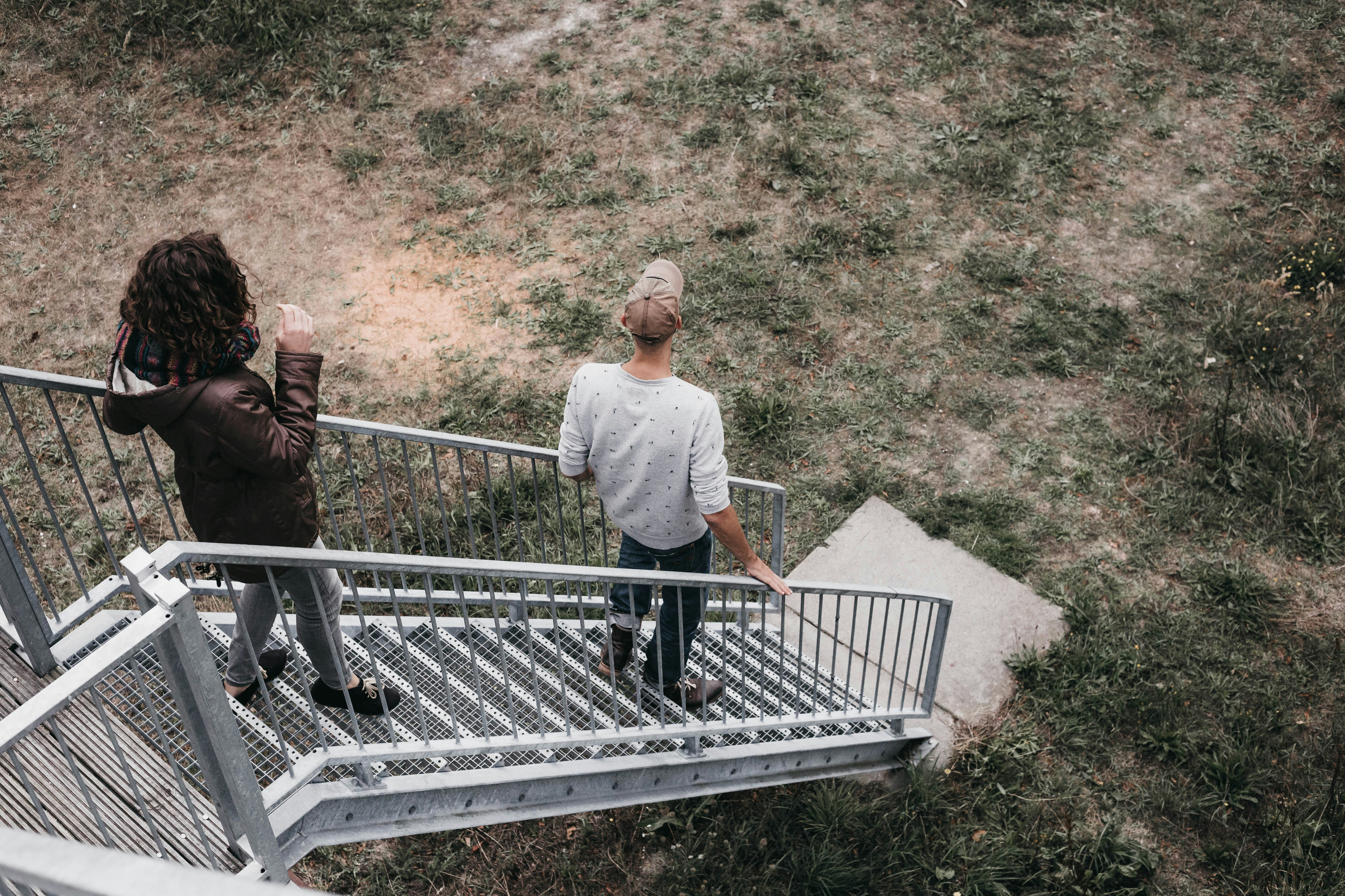 Two person walking on the stair photo – Free Woman Image on Unsplash