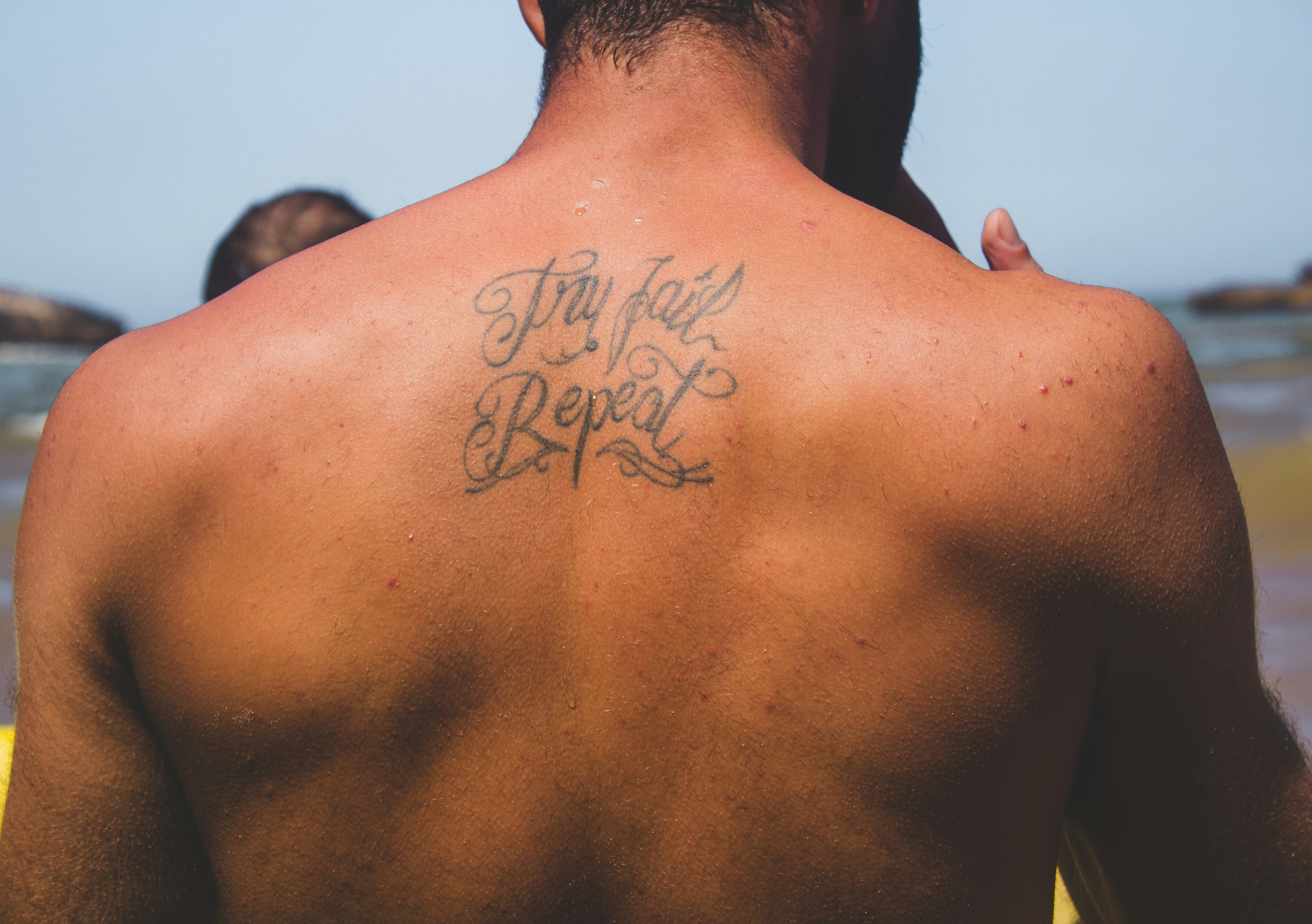Person with try fail repeat tattoo at back photo – Free Essaouira Image ...