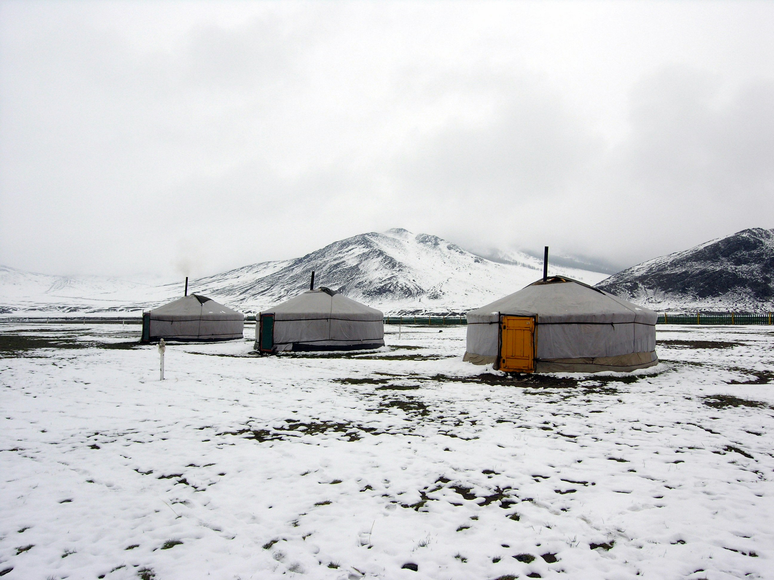 Three round tents surrounded by snow under nimbus clouds photo – Free ...