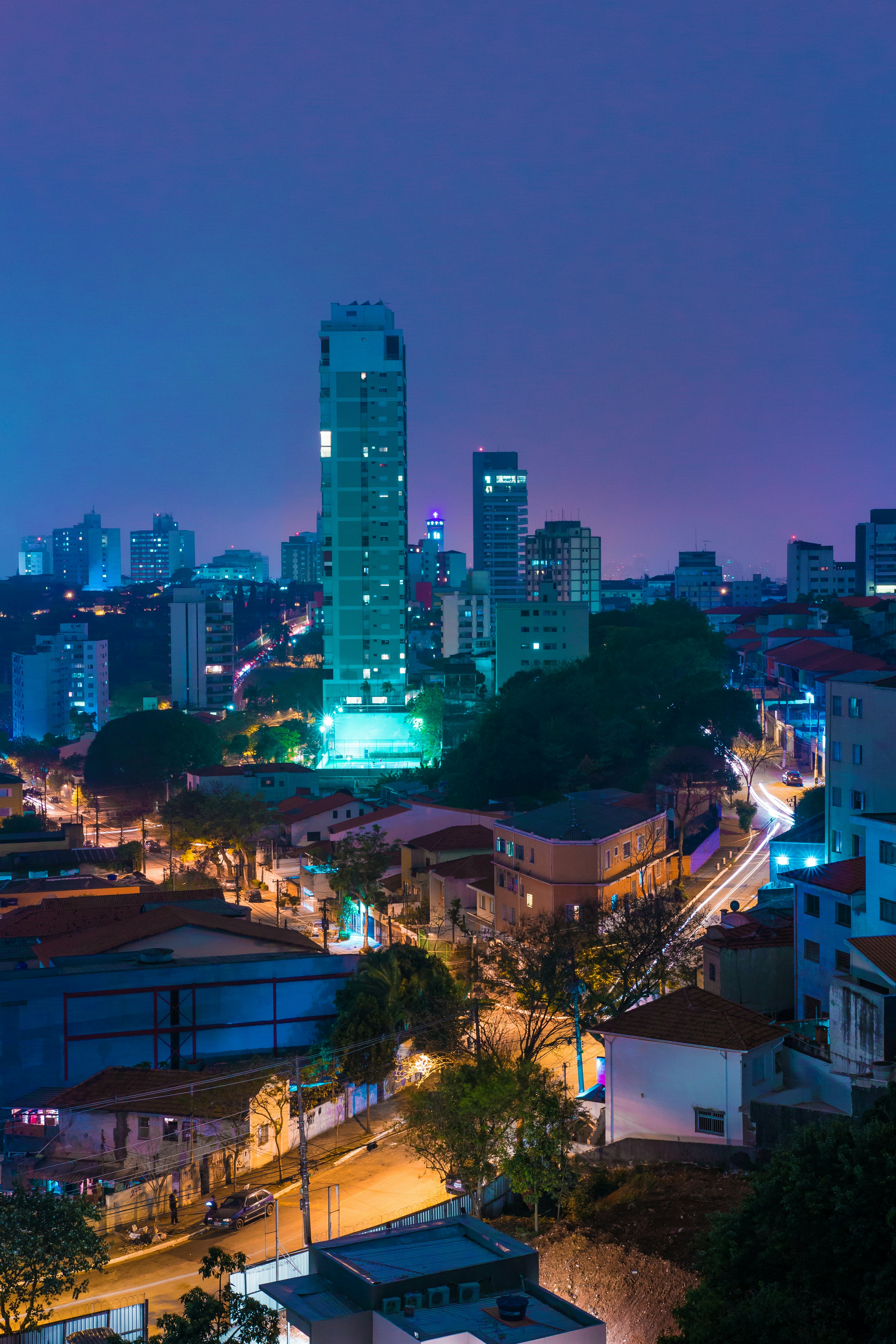 Turquoise Tower at Dusk: A Quiet Cityscape Woven with Neon Streets