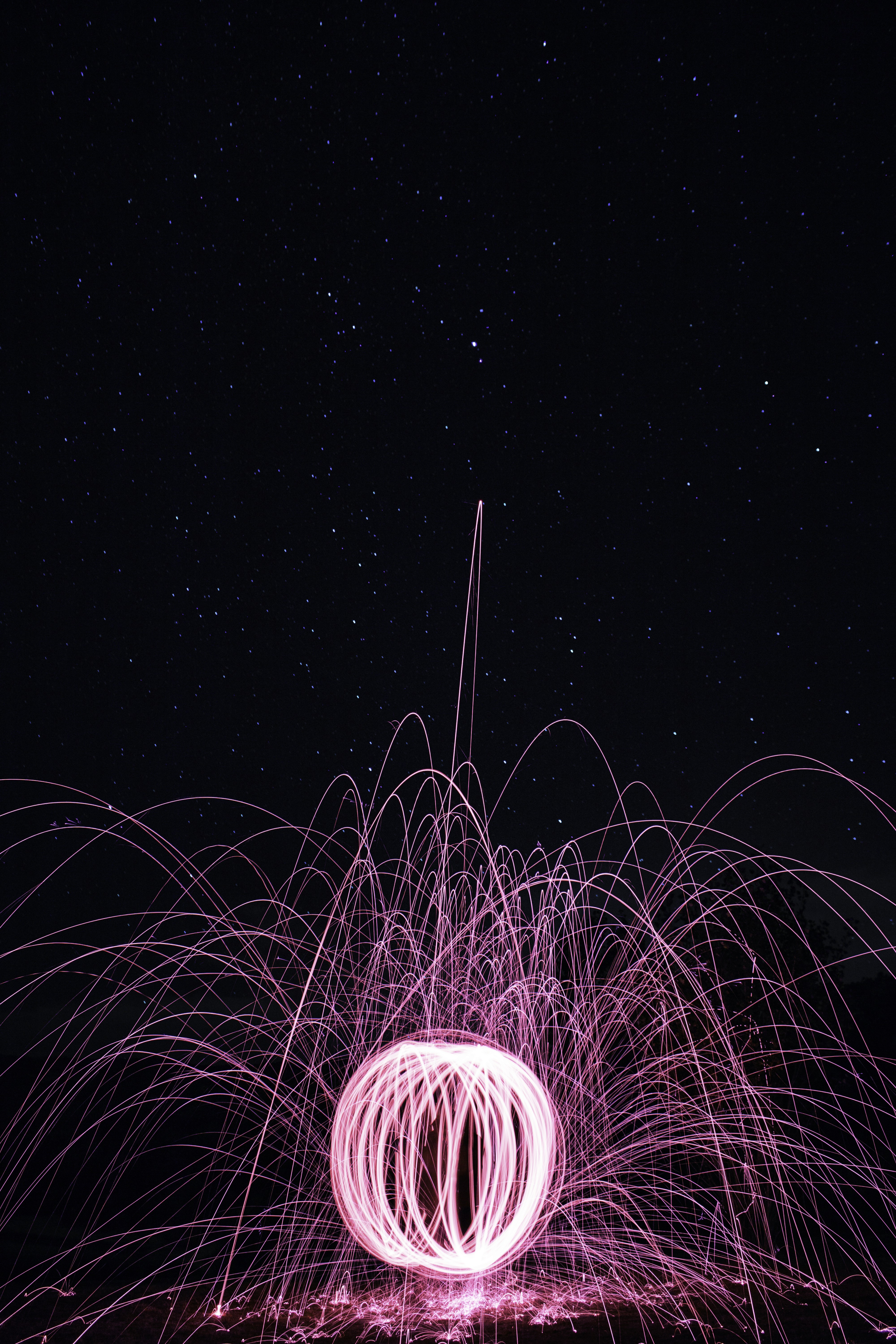 This is the first time we tried to create a spark trail effect. First, we wanted to make a milky way shoot but we missed it by 2 hours, so we decided to combine the night sky with some beautiful sparks. This photo is made by 2 different shots, each one with different adjustments, mixing them in post-production. It is done vertically for a better capture of the sky.