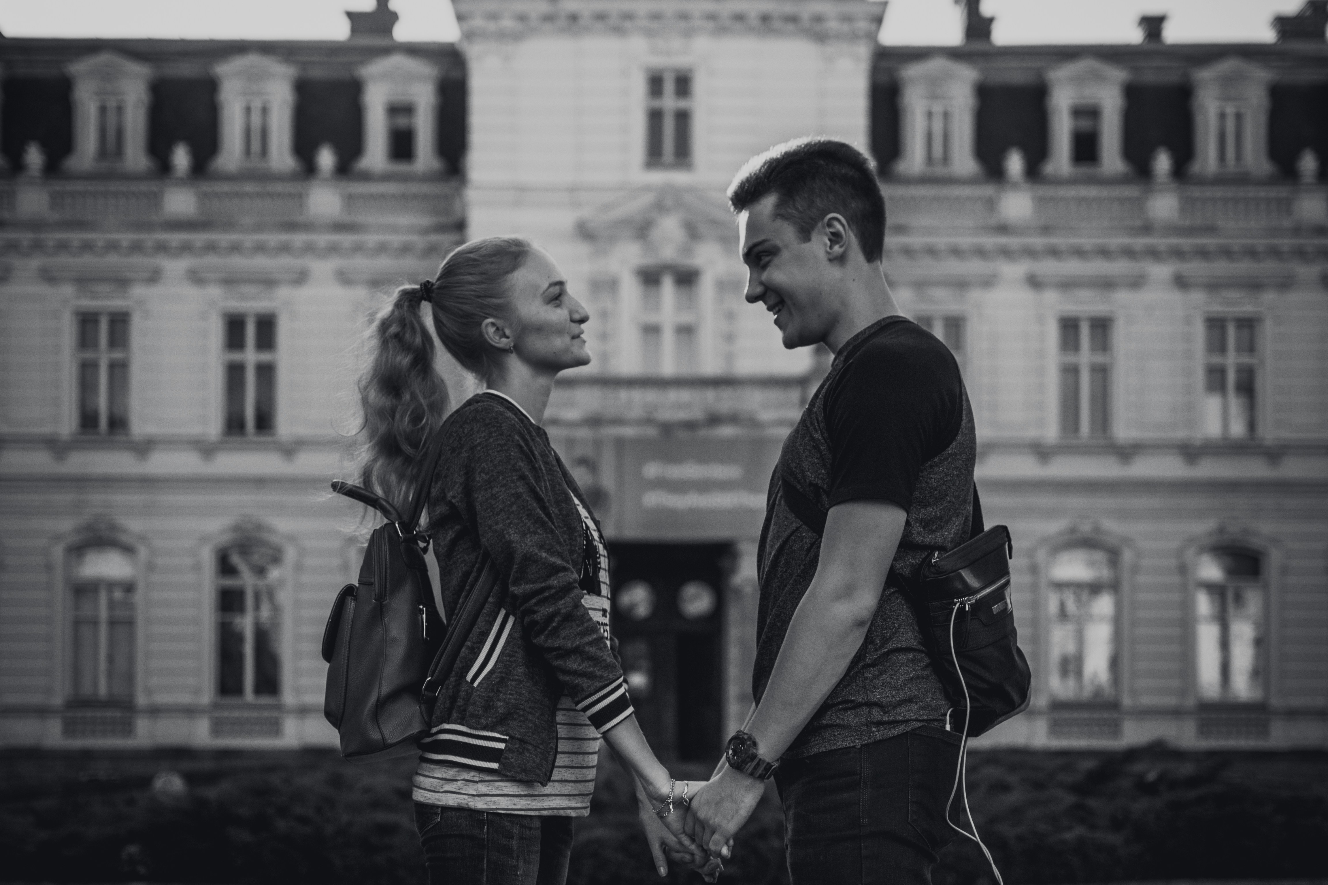 Two in Focus: Quiet Affection Before a Neoclassical Facade