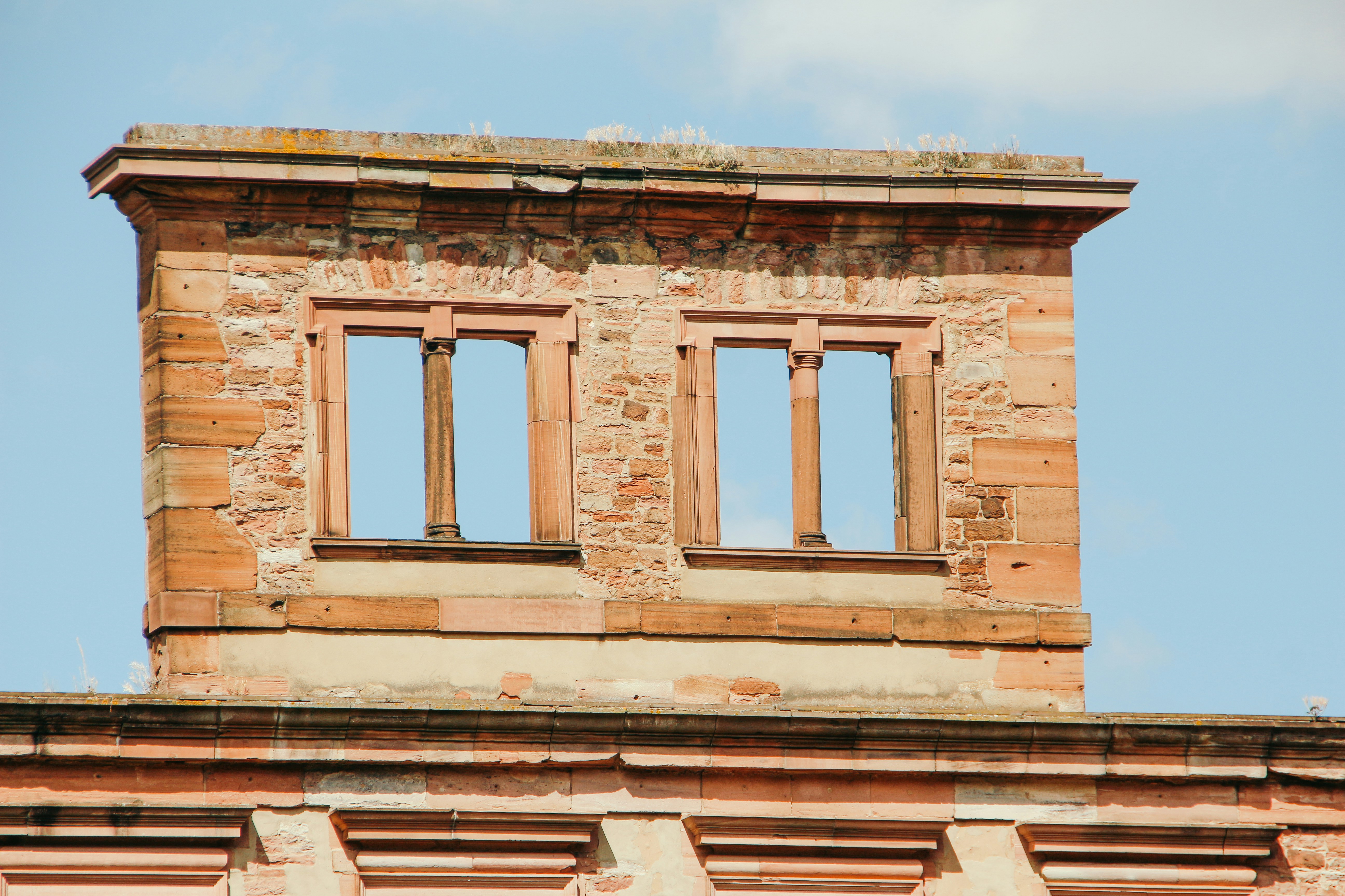 Brick Terrace: Windowed Turret atop a Weathered Facade