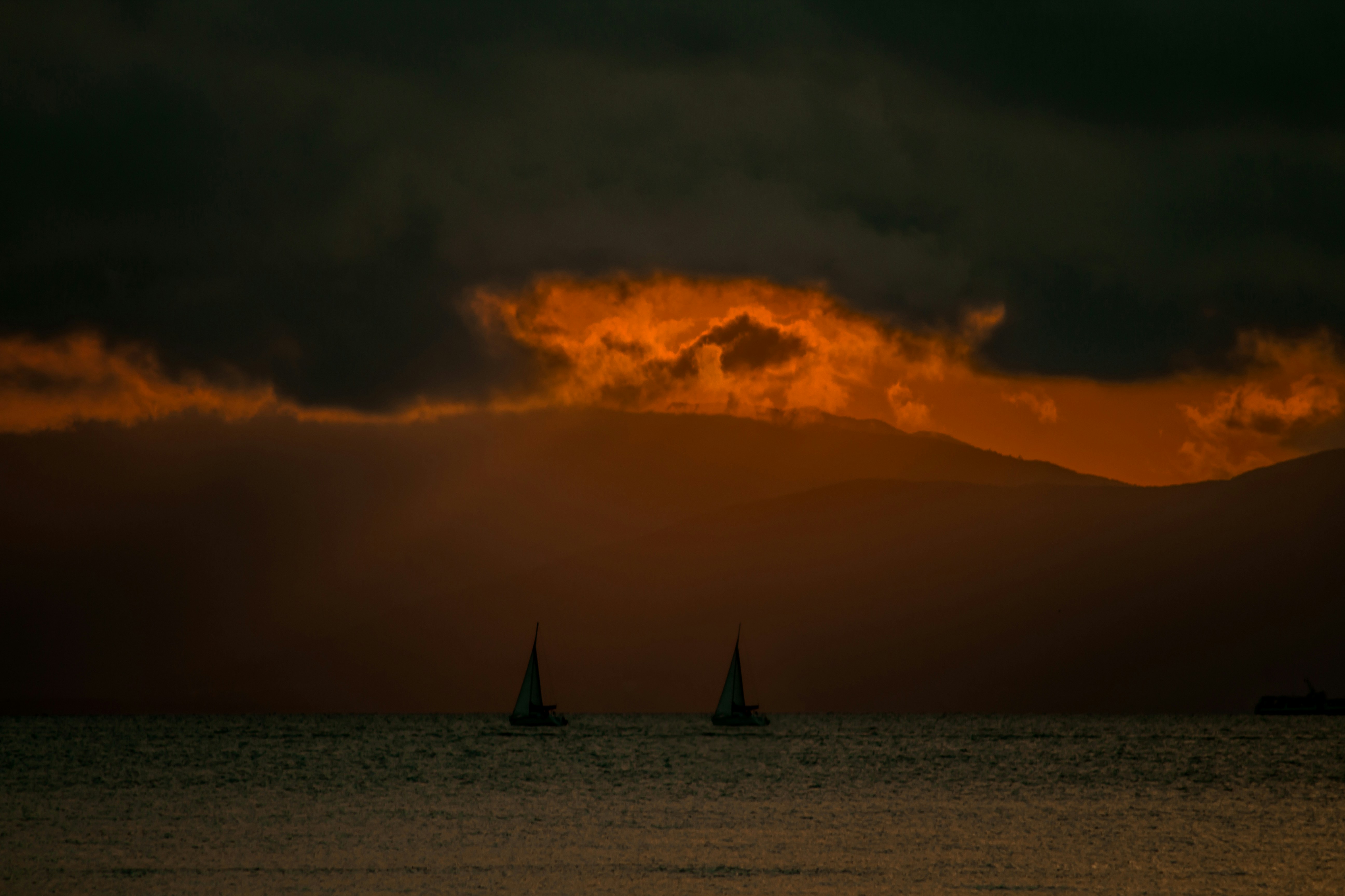 Twilight Sail Beneath Fiery Skies