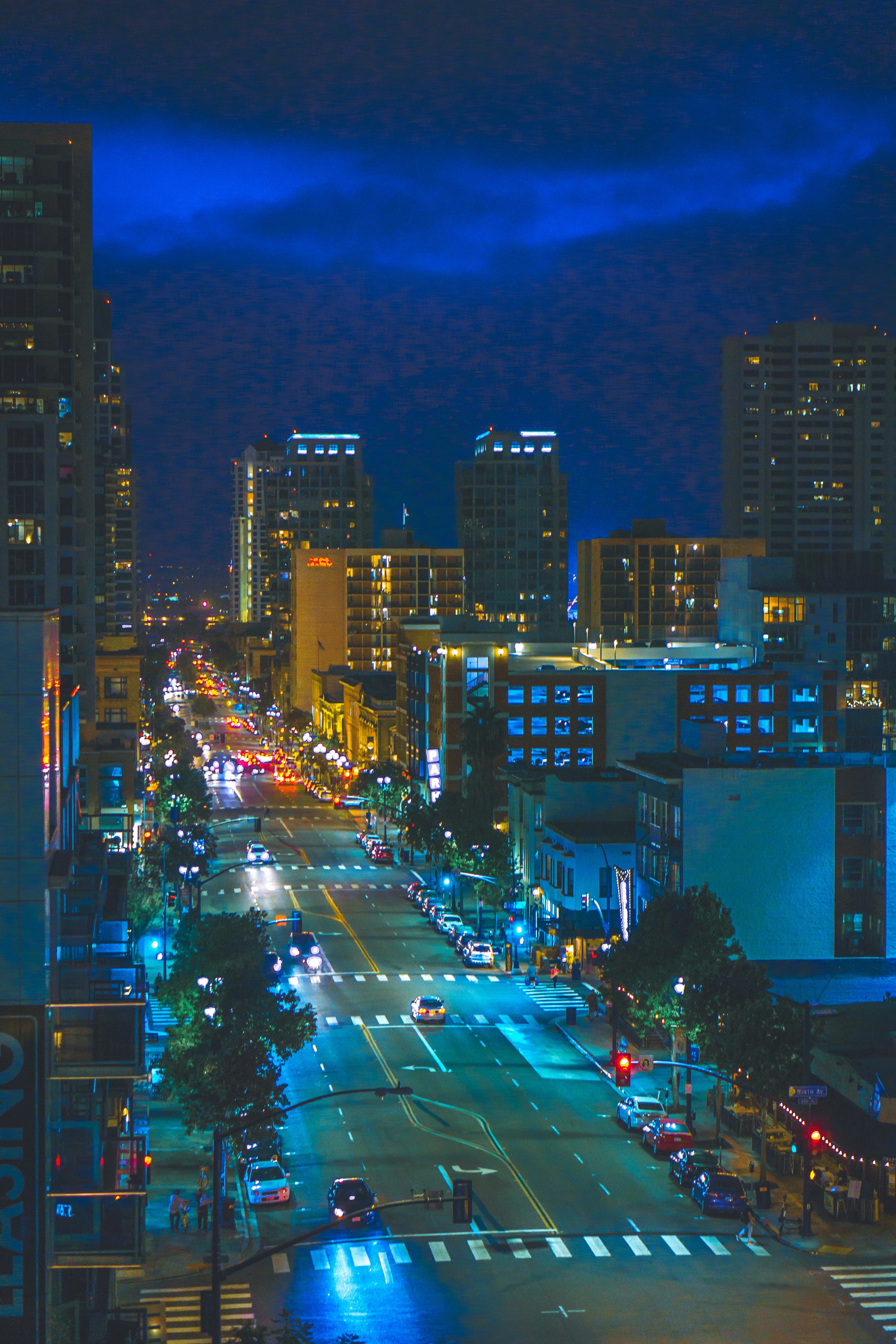 Neon Avenue Nightscape: Blue-Glow Downtown Crossroad