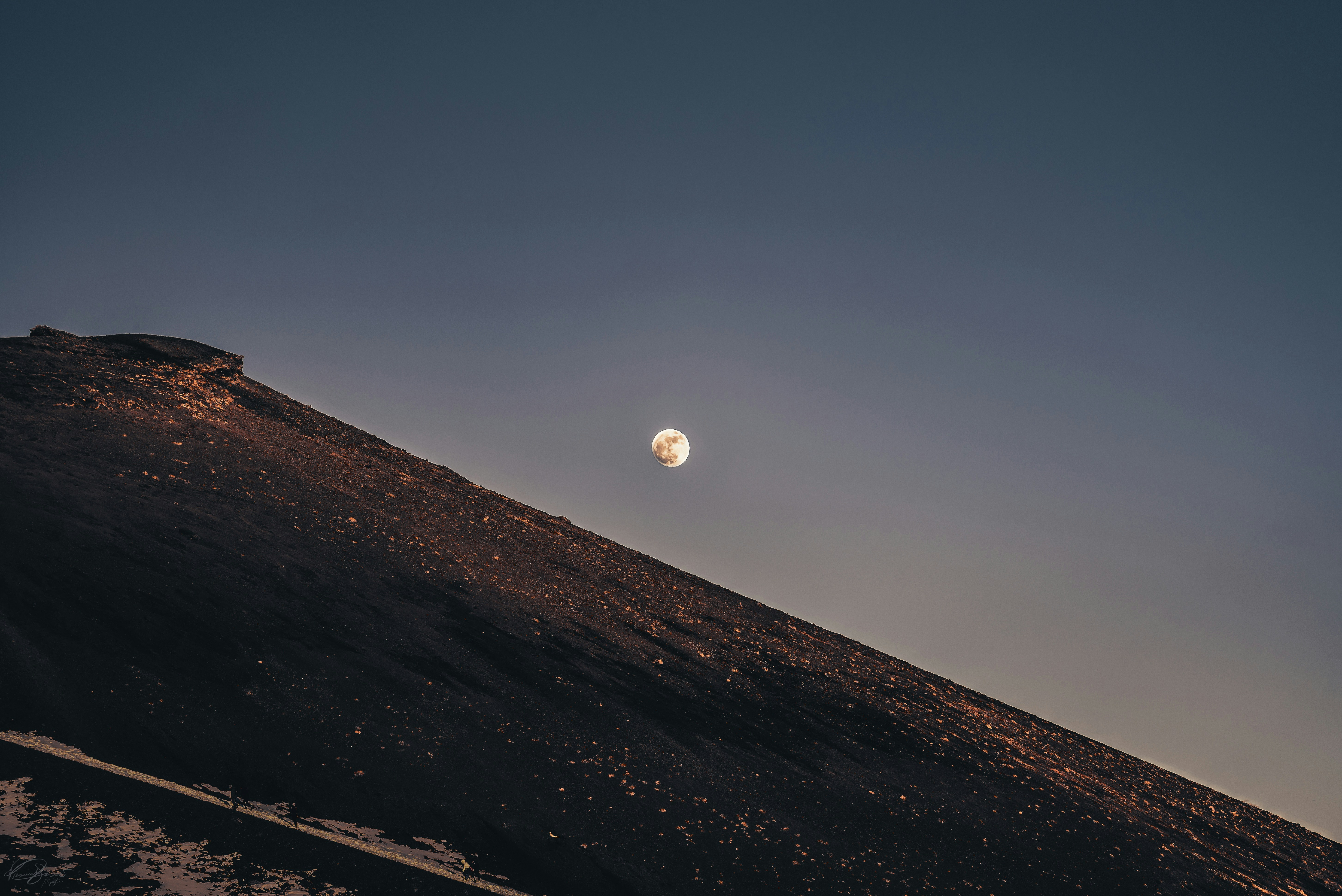 A full moon rising over a hill in the desert photo – Free Grey Image on ...