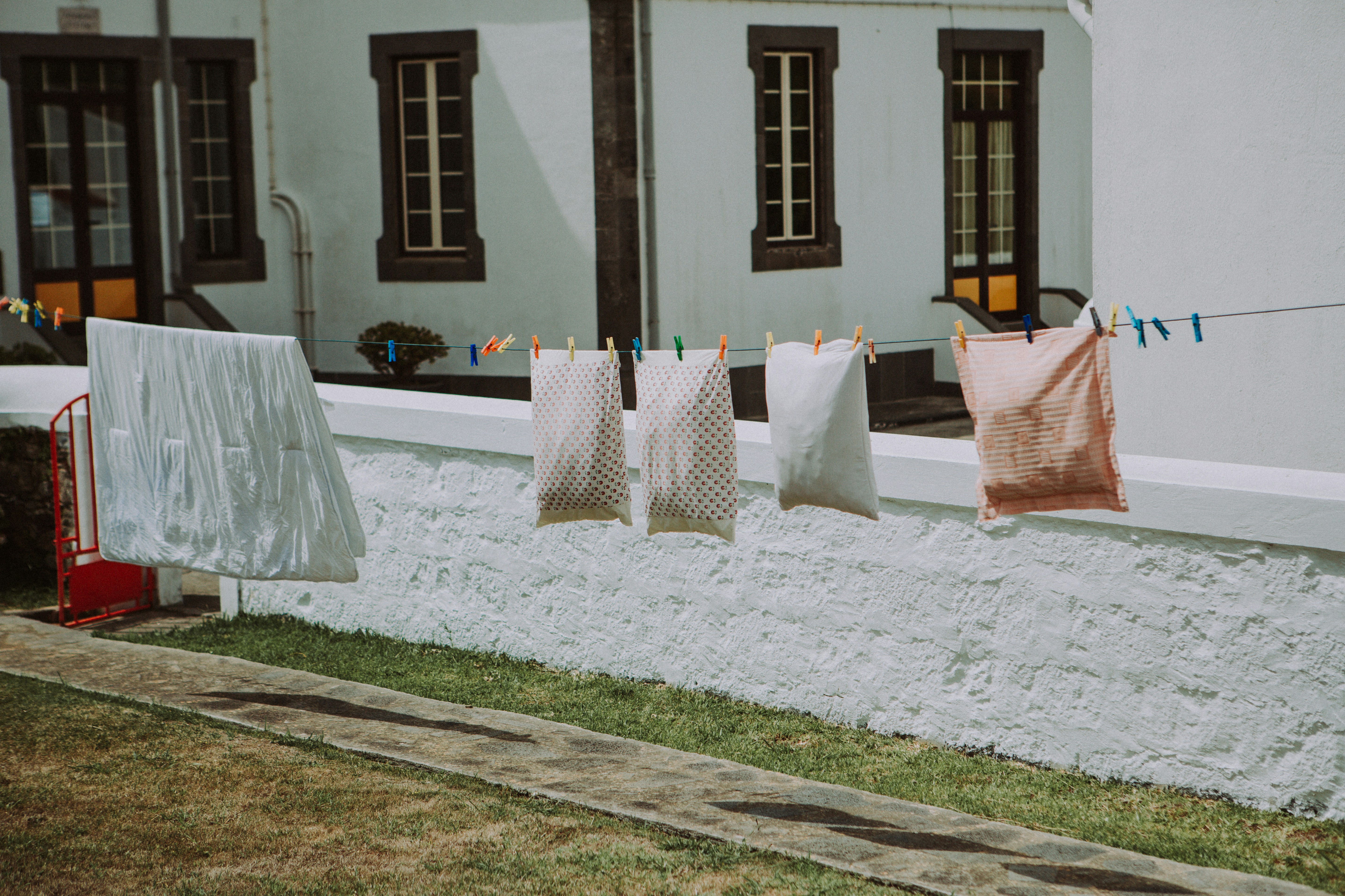 Pastel Laundry on a Sunlit Courtyard Clothesline