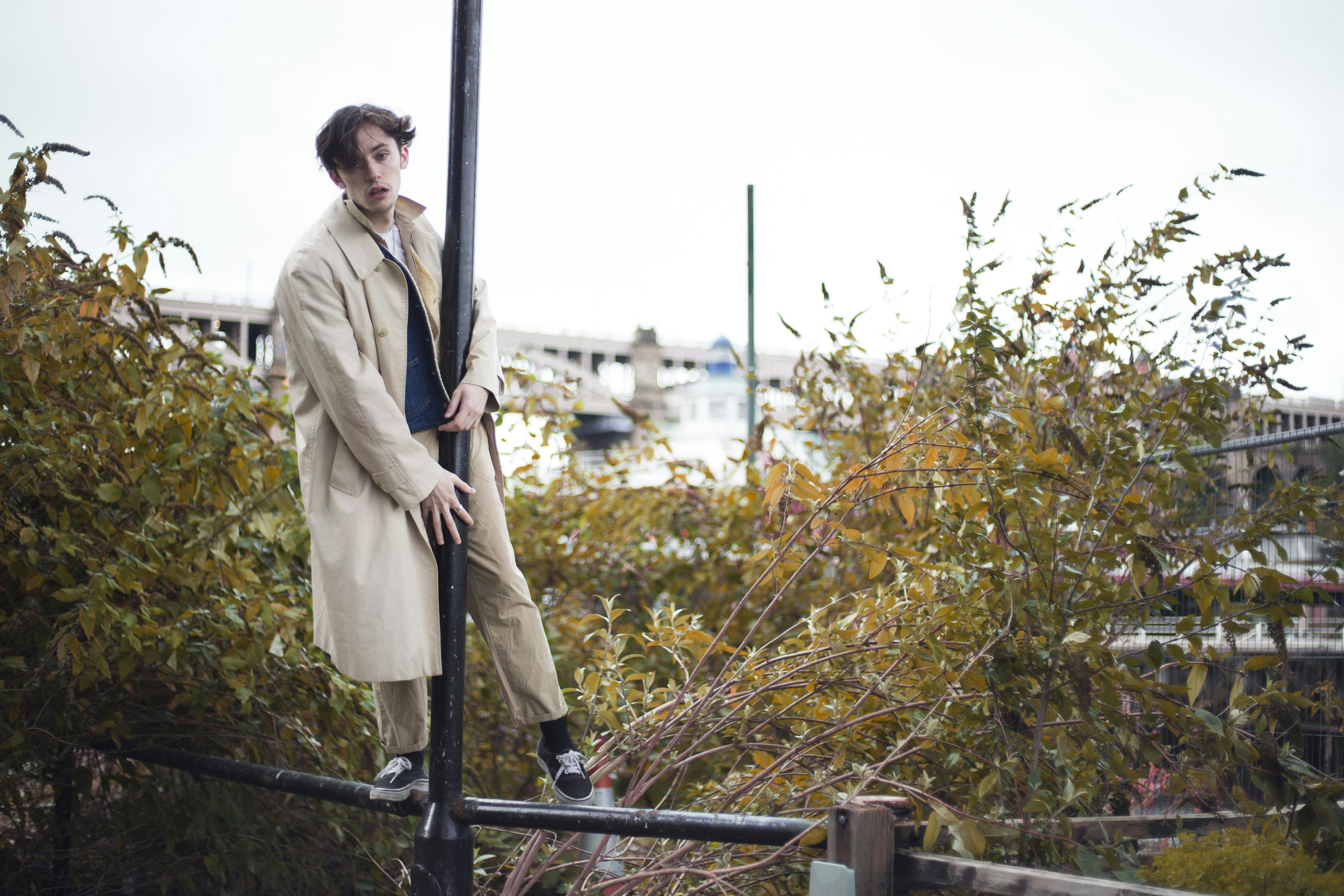 Standing man on pole wearing beige parka photo – Free Newcastle upon ...
