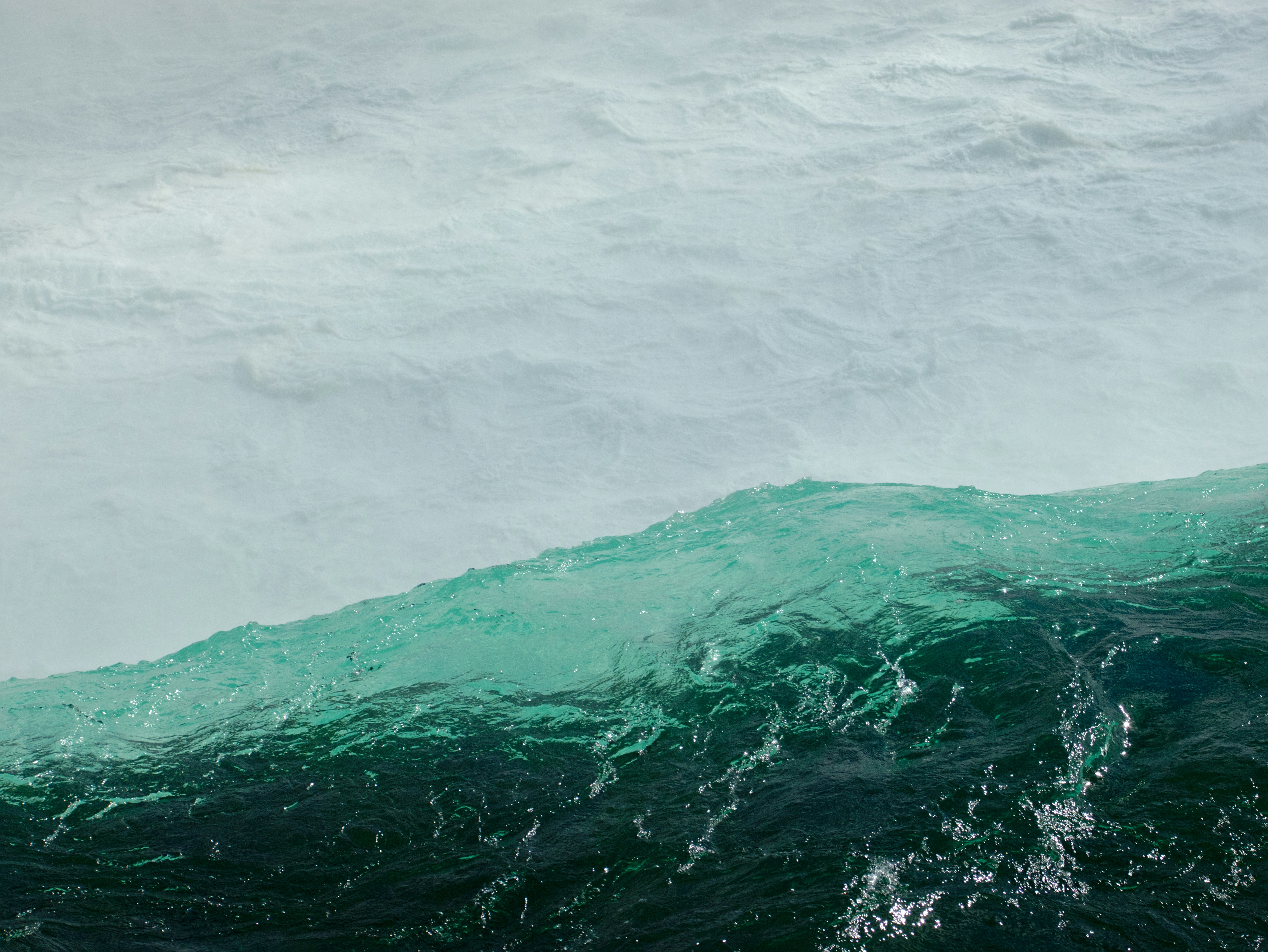 Churning turquoise waters of Horseshoe Falls under a misty sky.