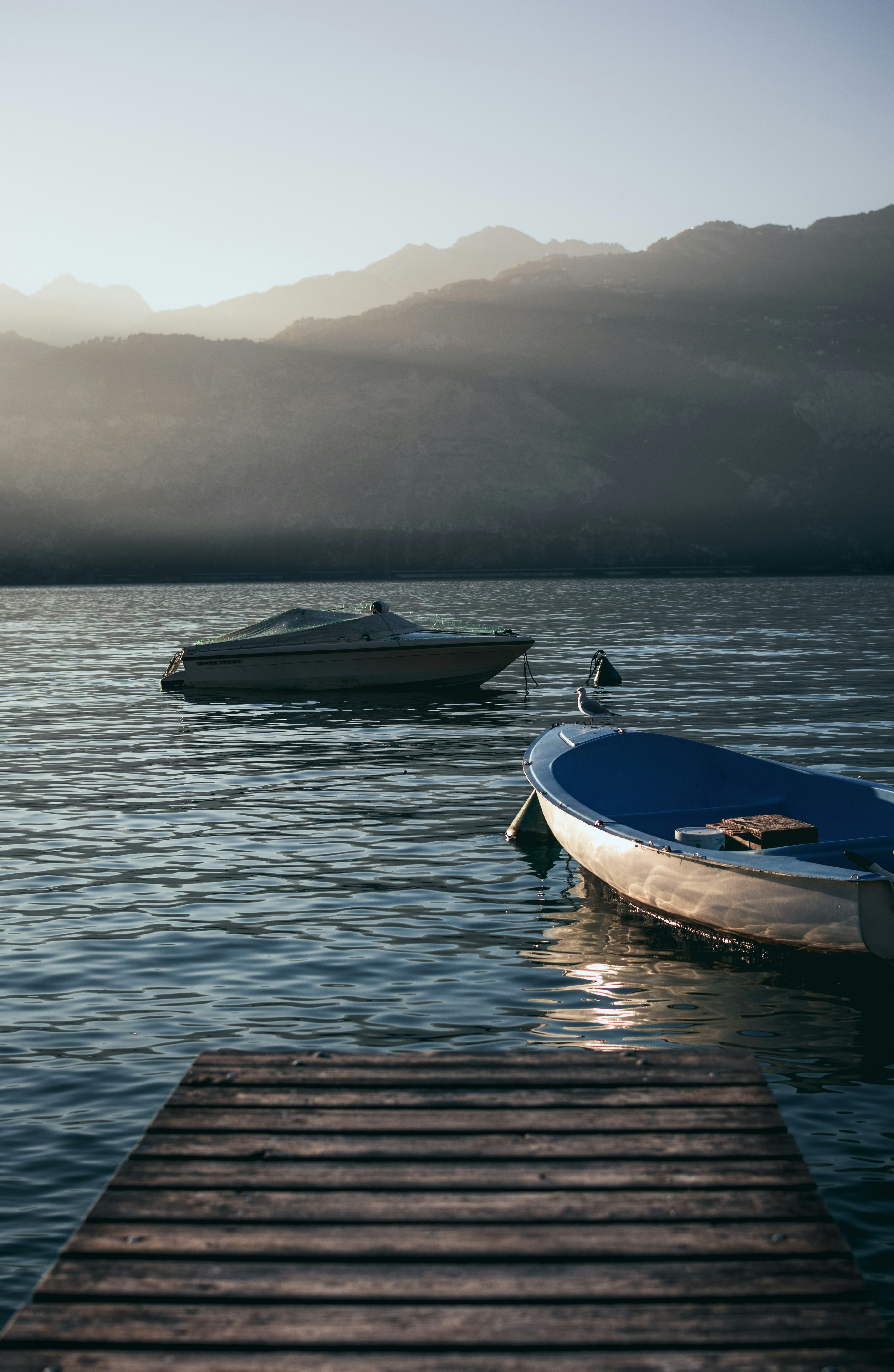 Two gray boats on body of water photo – Free Grey Image on Unsplash