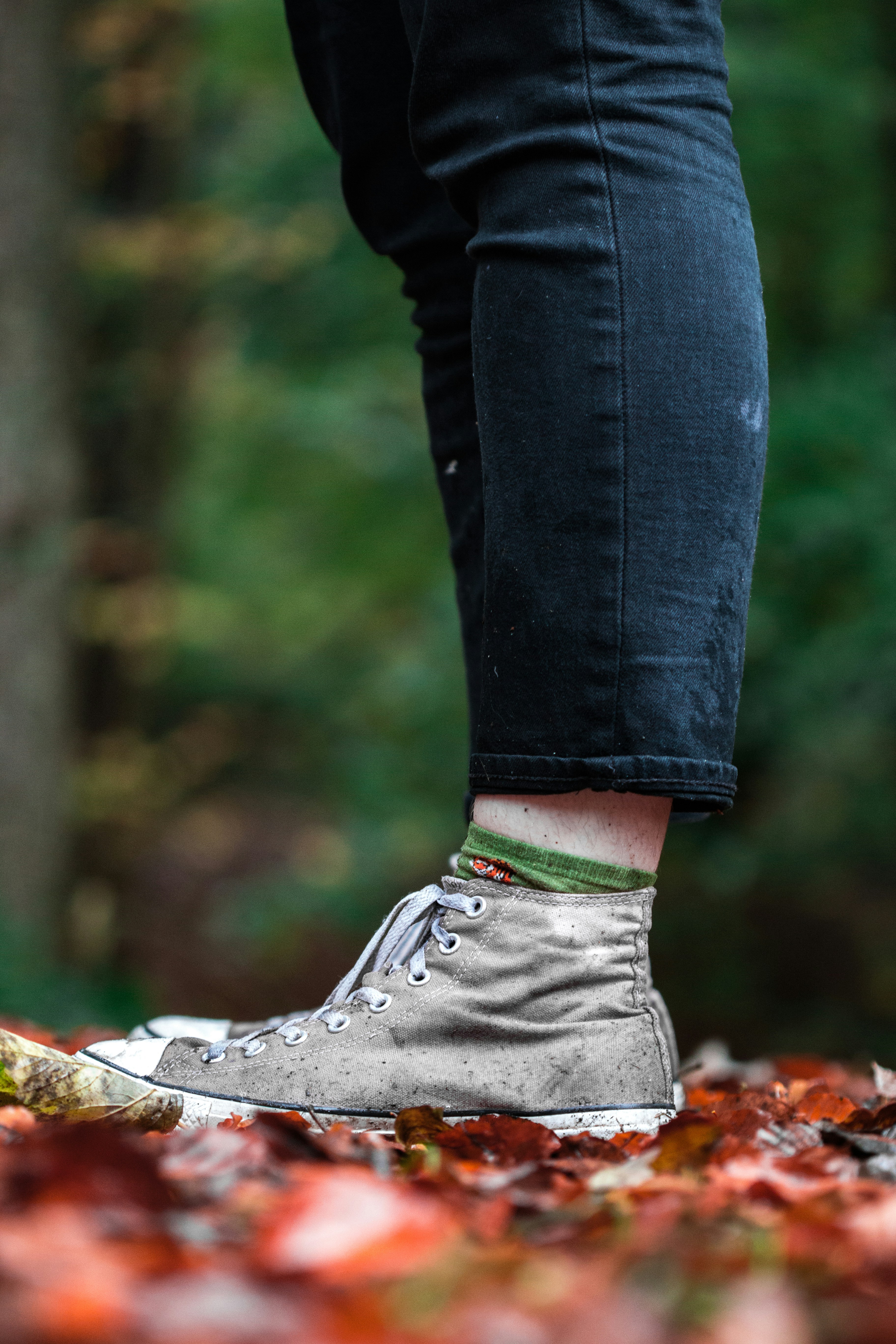 Trail shoe in autumn leaves: a close-up of footwear in a forest scene